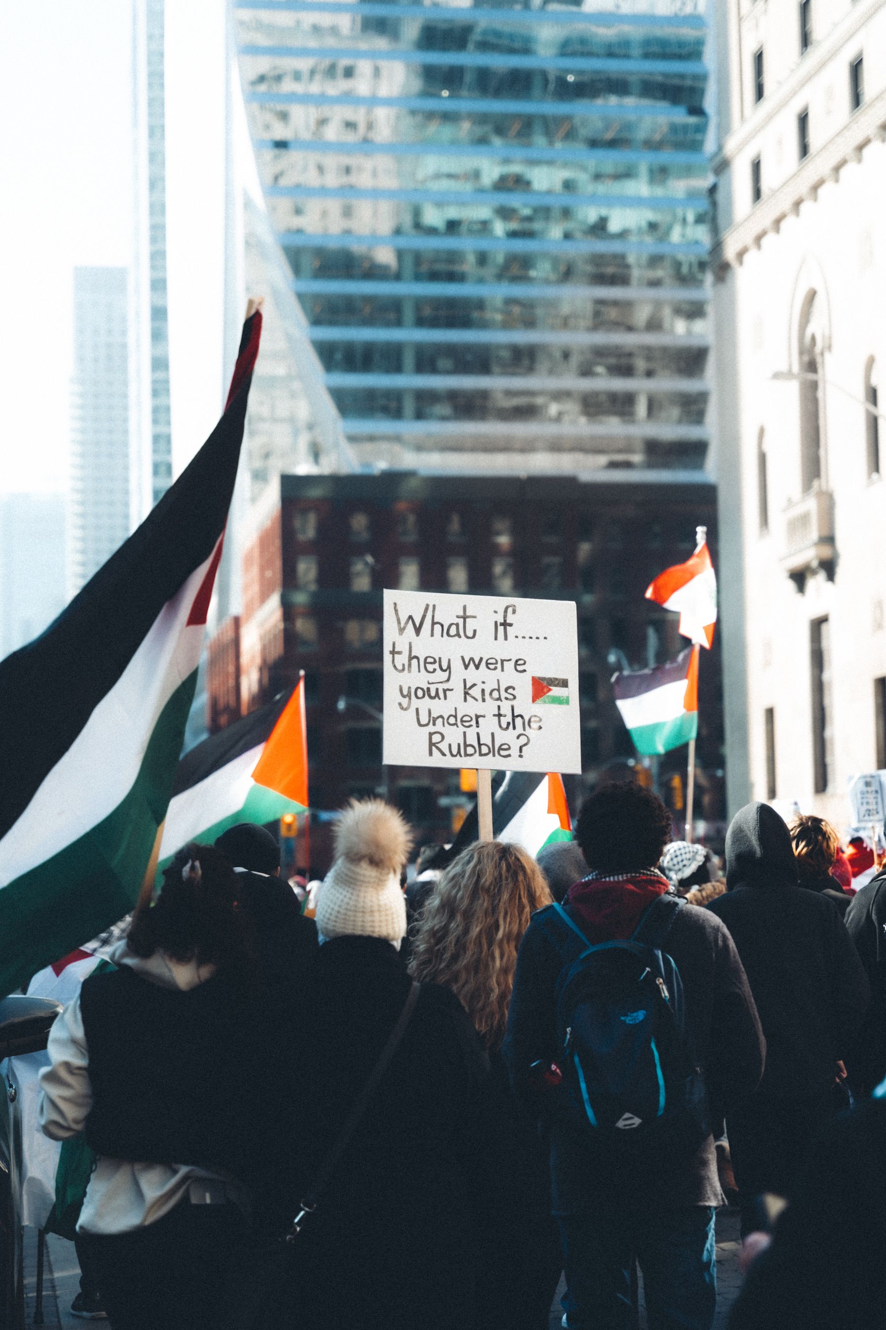 A group of people holding signs and flags · Free Stock Photo