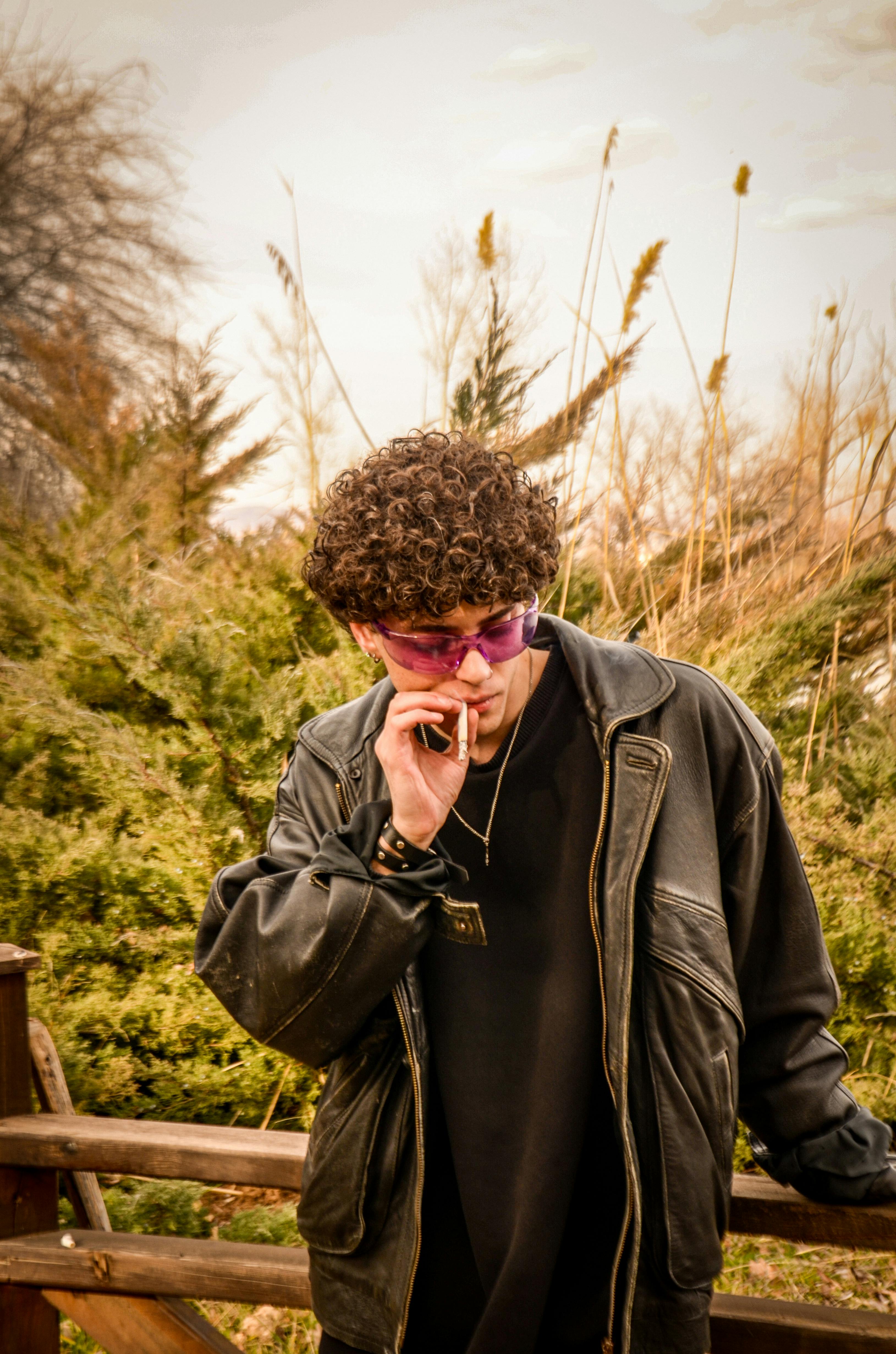 Portrait of Man in Leather Jacket Smoking Cigarette · Free Stock Photo
