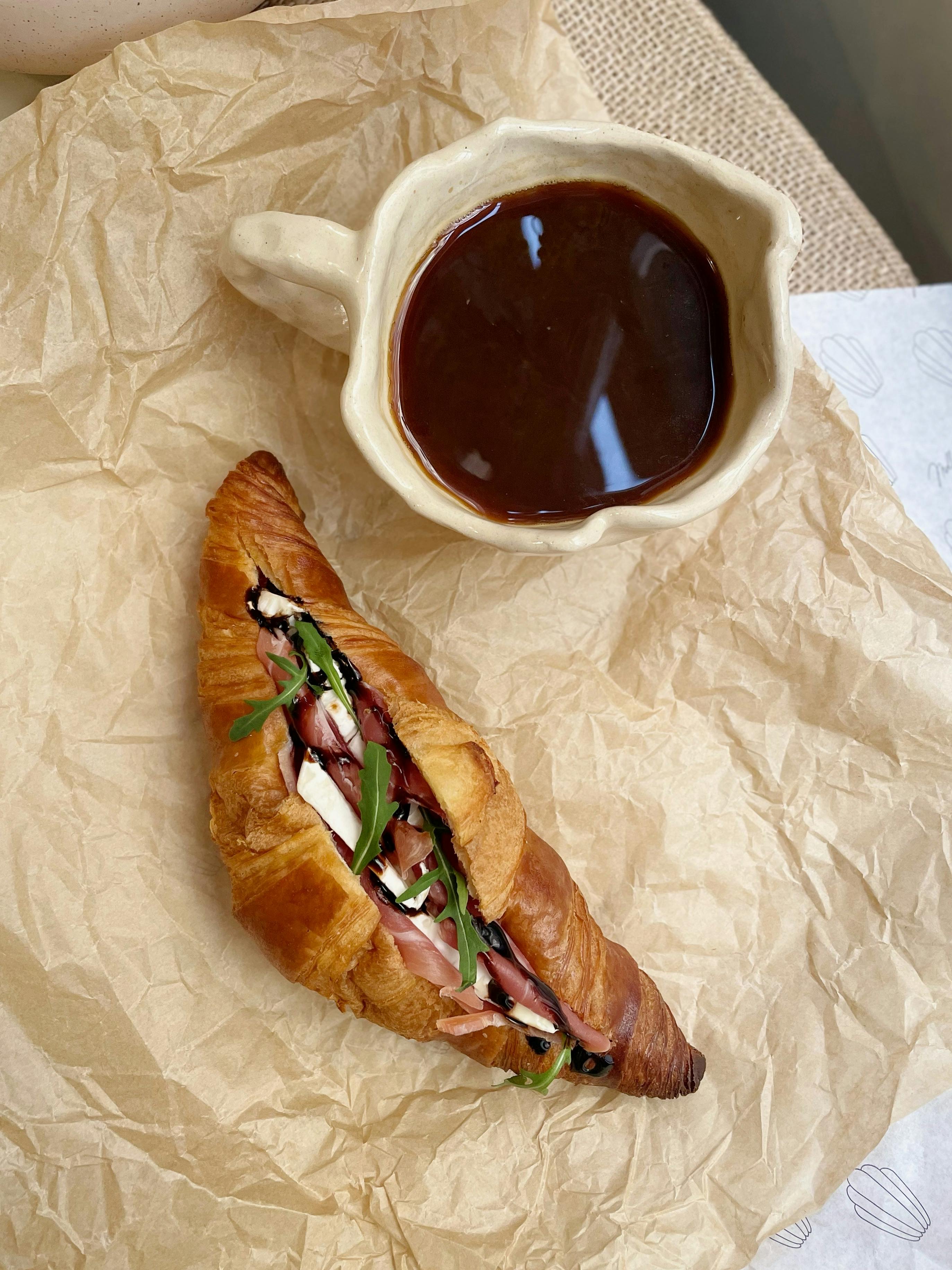 Coffee and Croissant Sandwich · Free Stock Photo