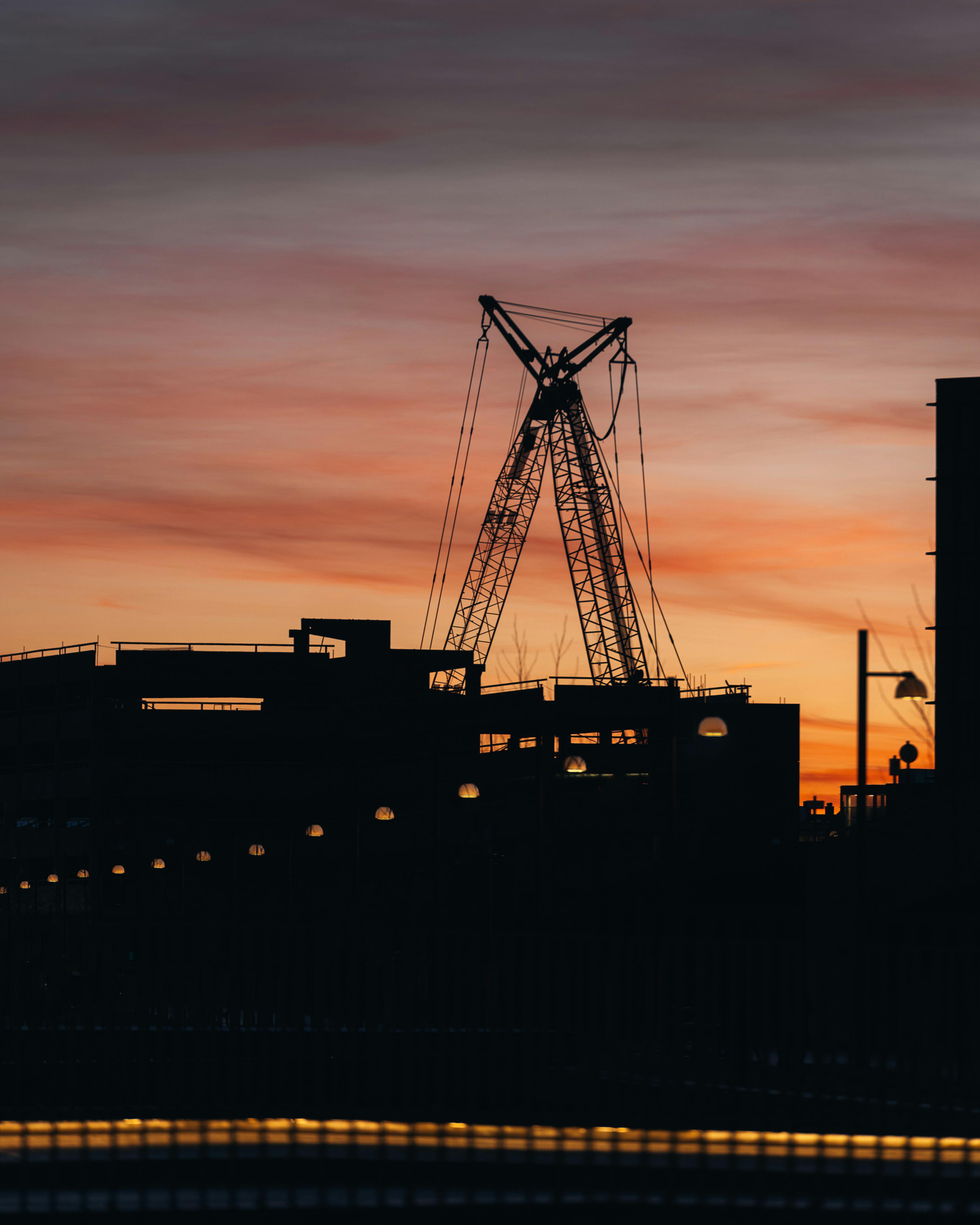 Harbor Infrastructure Silhouette at Sunset · Free Stock Photo