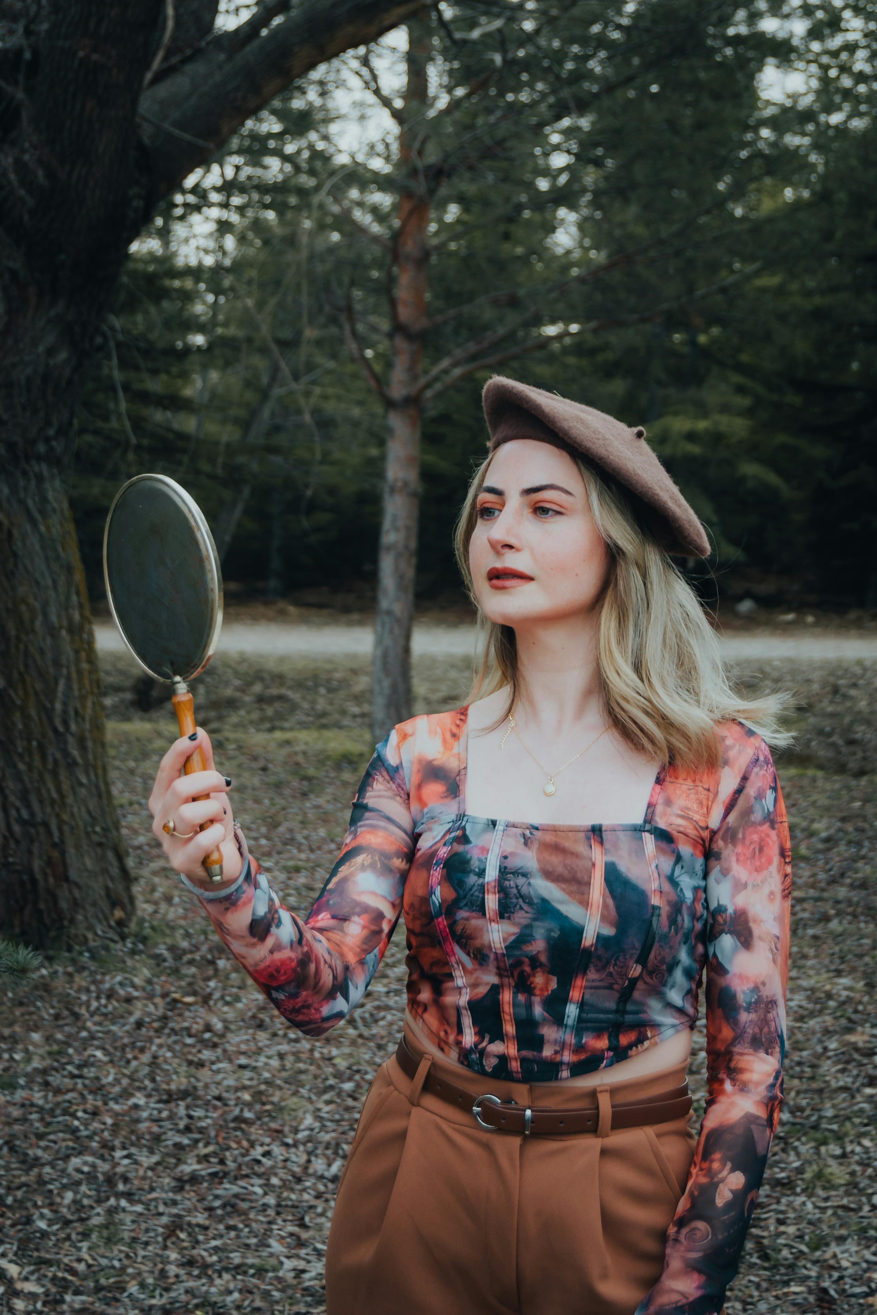 Portrait of Woman Holding Mirror · Free Stock Photo