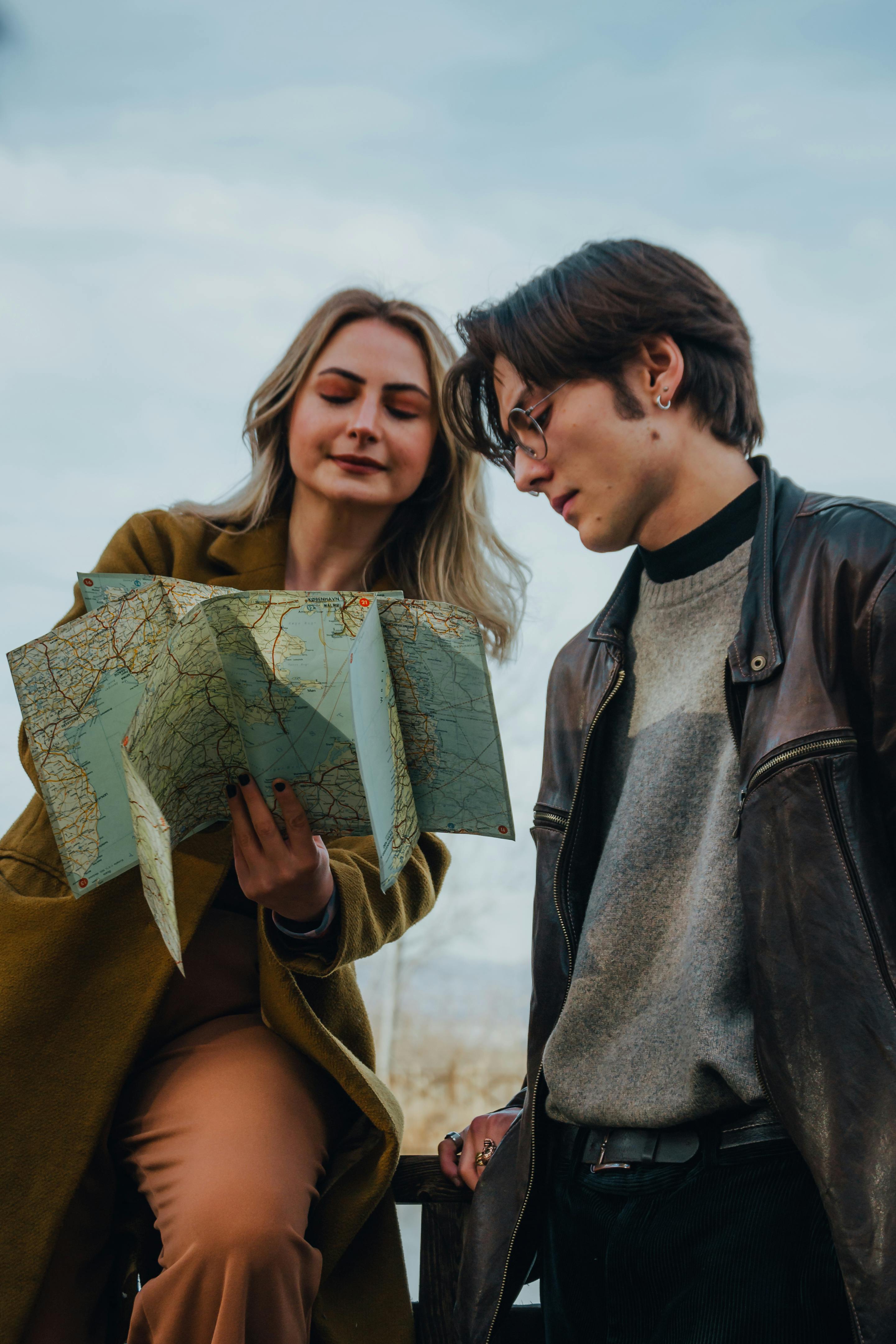 Woman and Man Looking at Map · Free Stock Photo