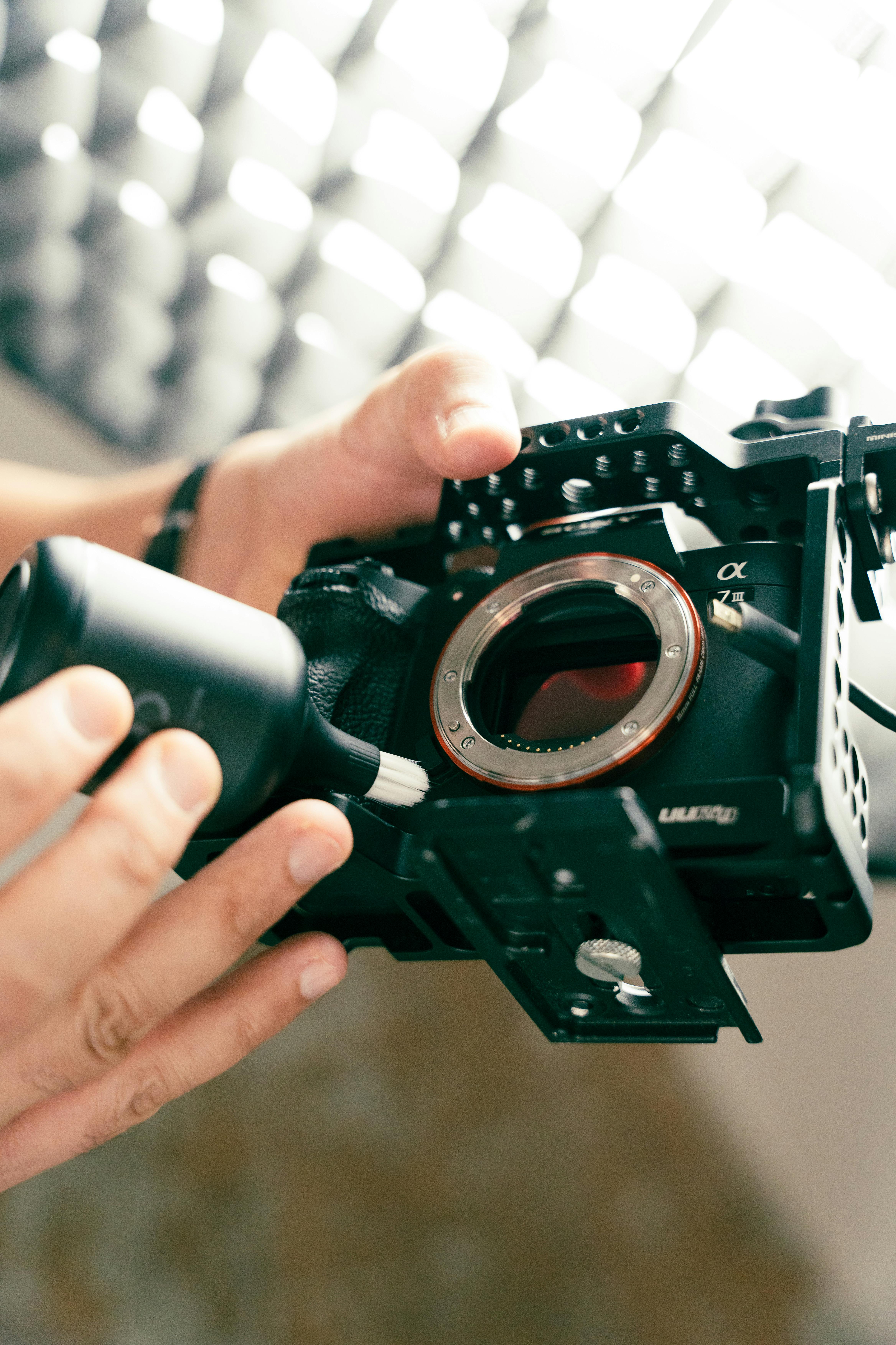 Man Hands Cleaning Camera · Free Stock Photo