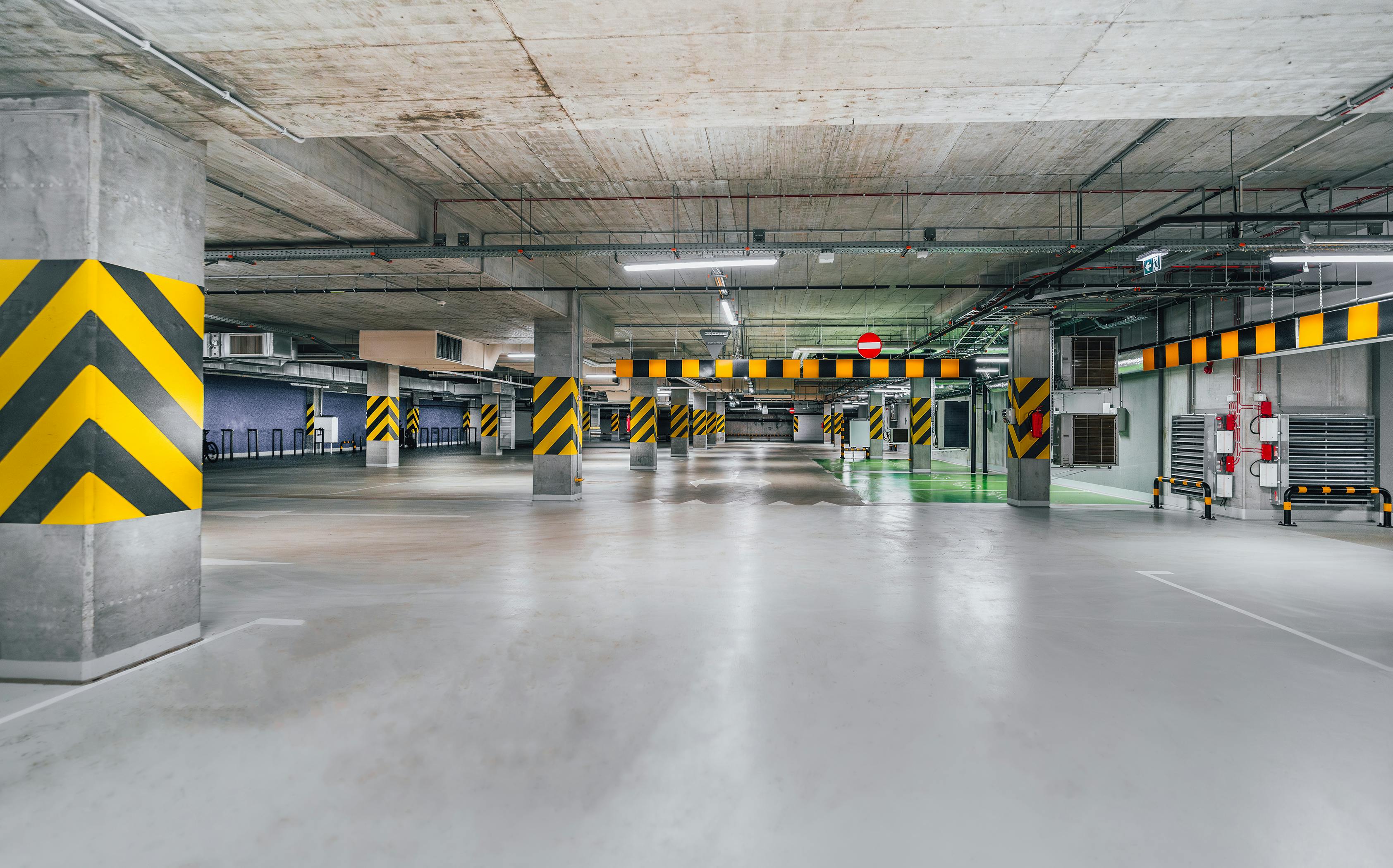 Empty Underground Garage with Bicycle Racks · Free Stock Photo
