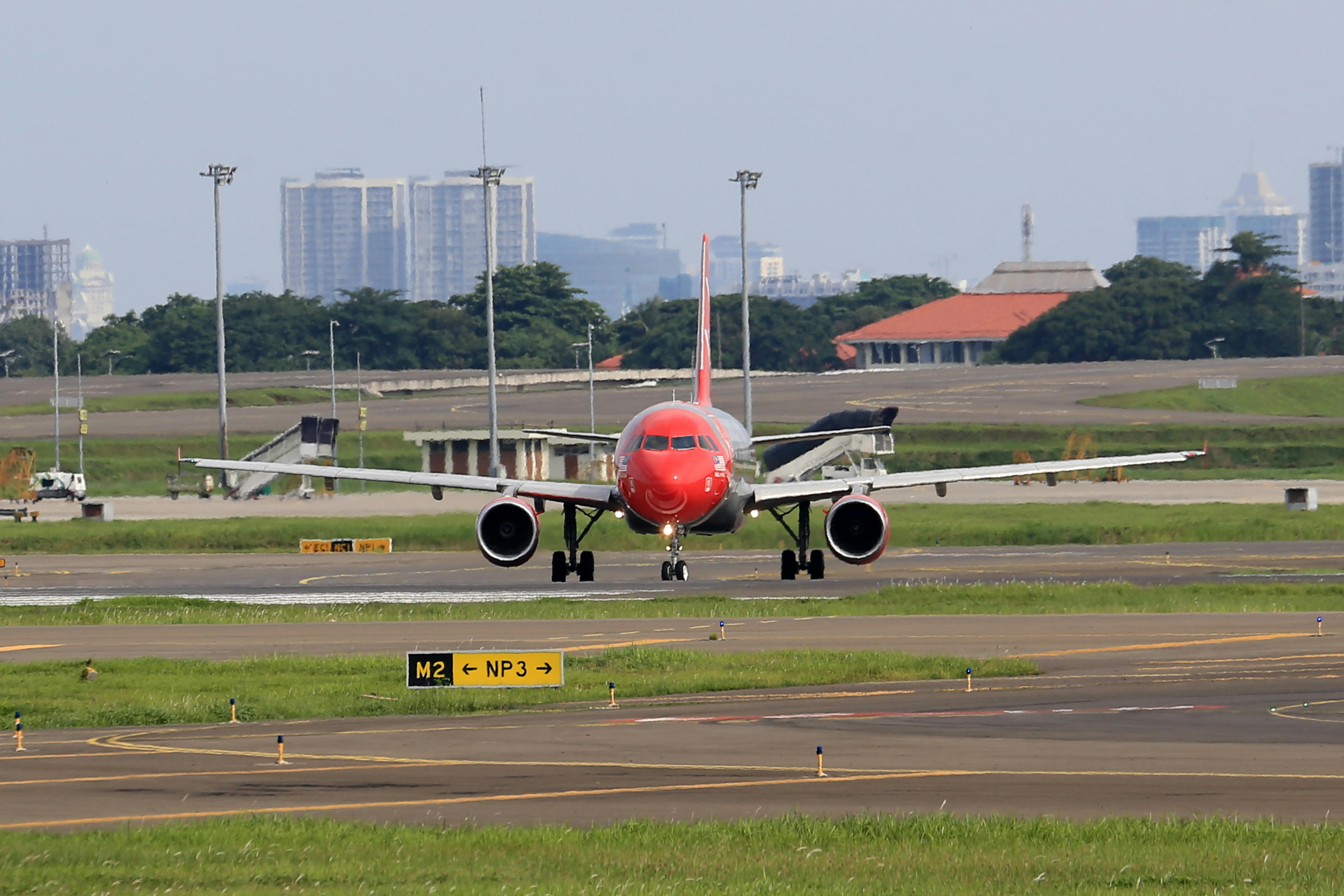 Photo of an AirAsia Airliner on a Runway · Free Stock Photo
