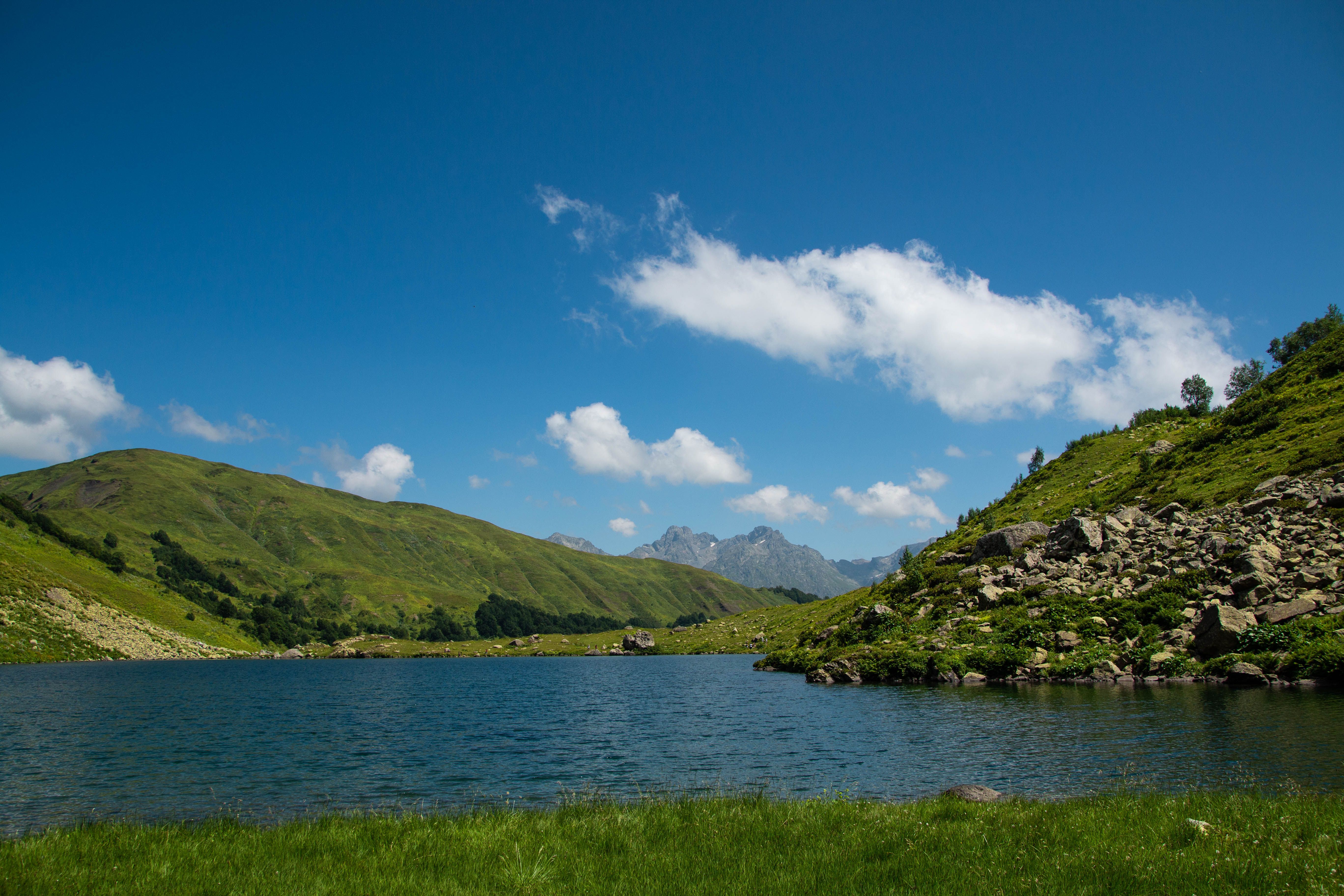 Lake and Green Hills in Countryside · Free Stock Photo