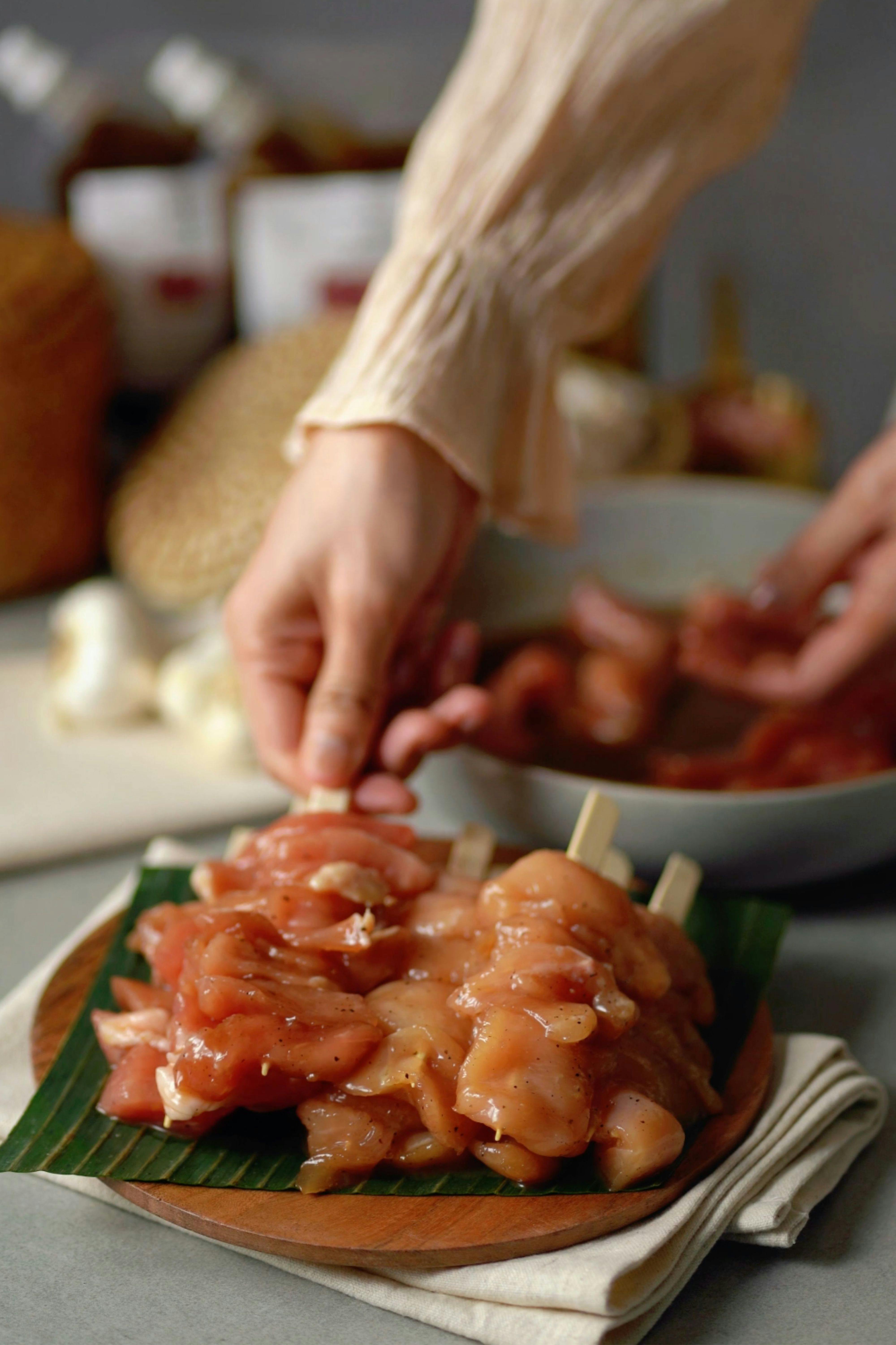 Woman Preparing Chicken Meal · Free Stock Photo