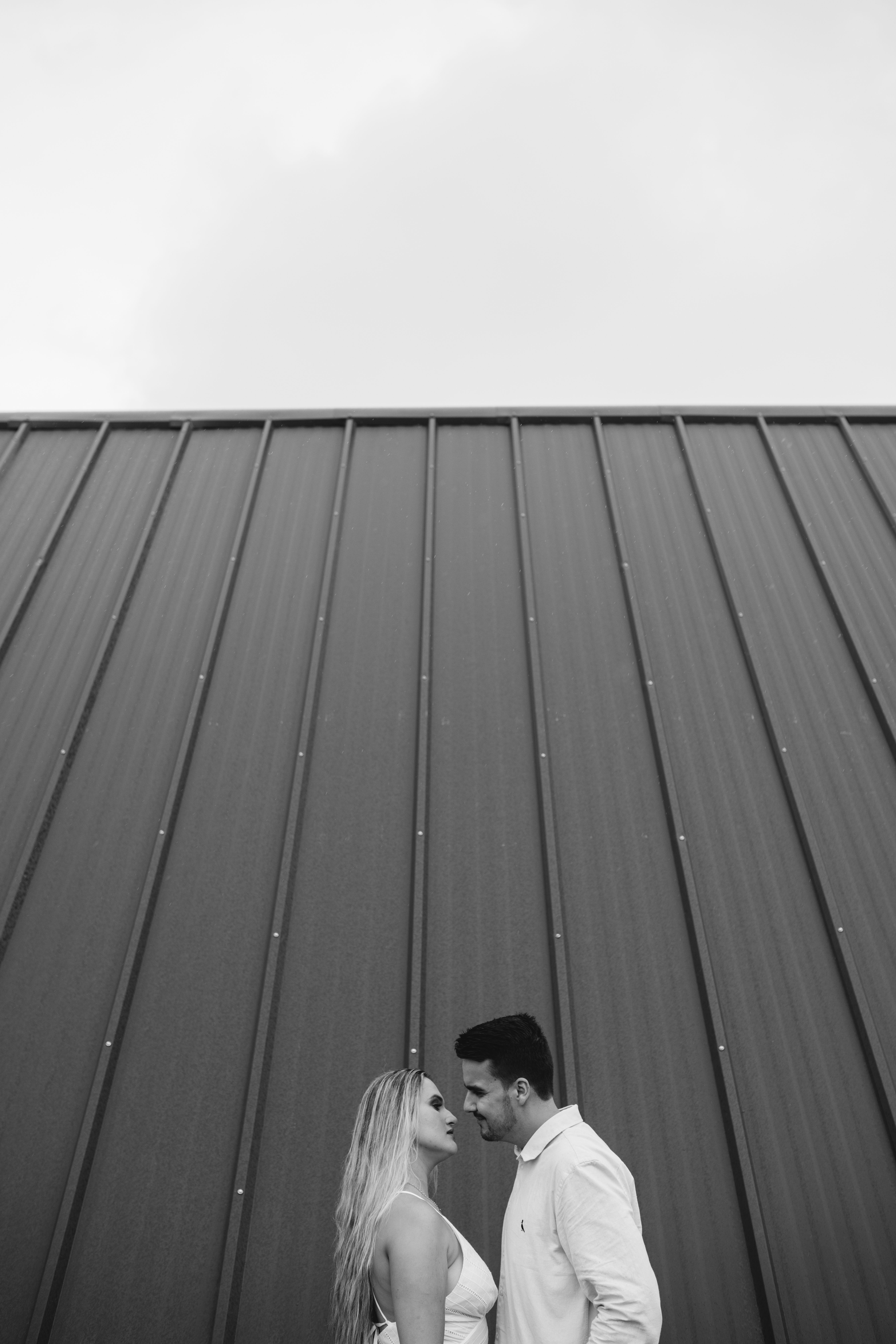 Couple Standing near Wall · Free Stock Photo