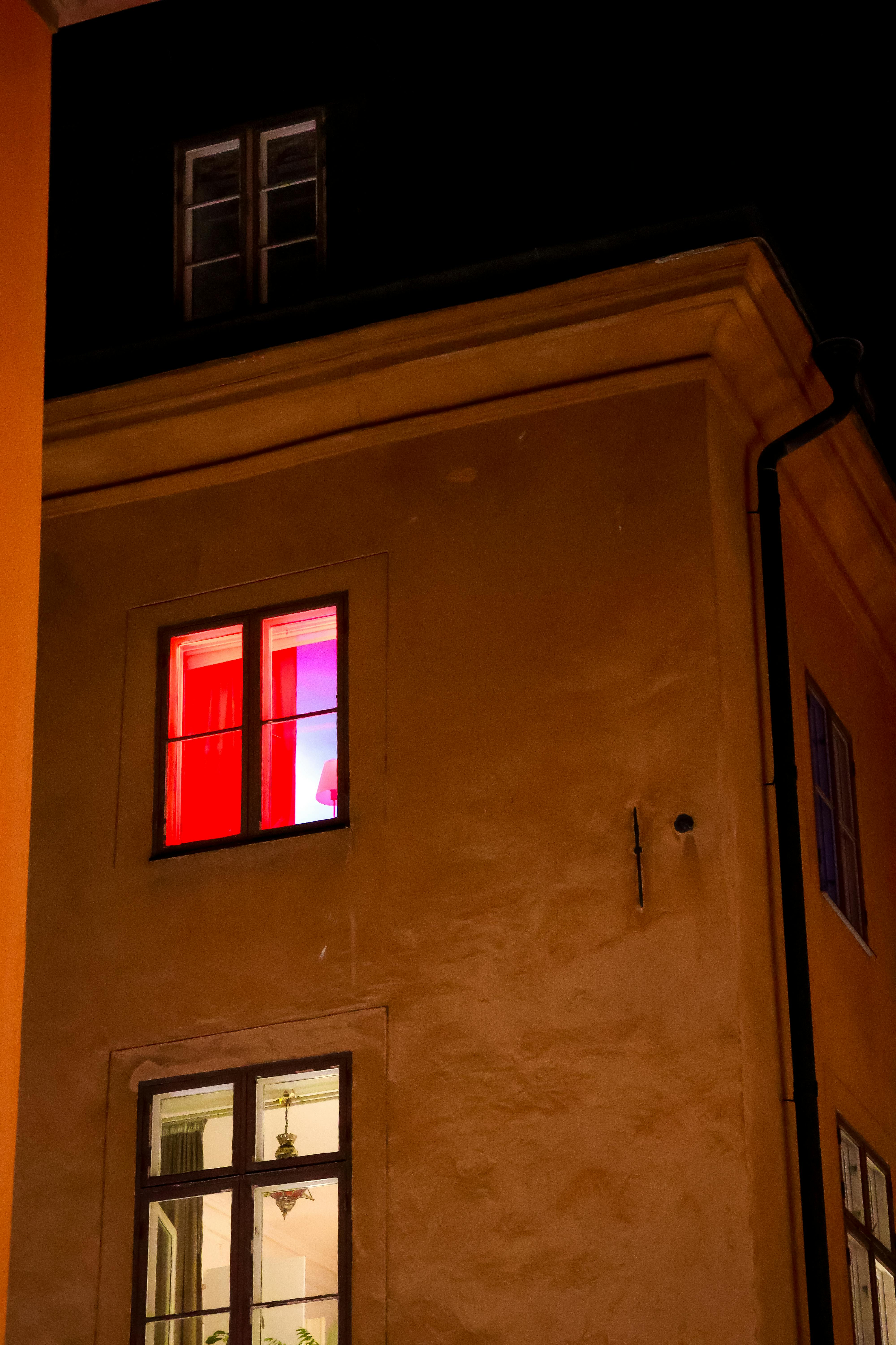Red Light in a Window · Free Stock Photo