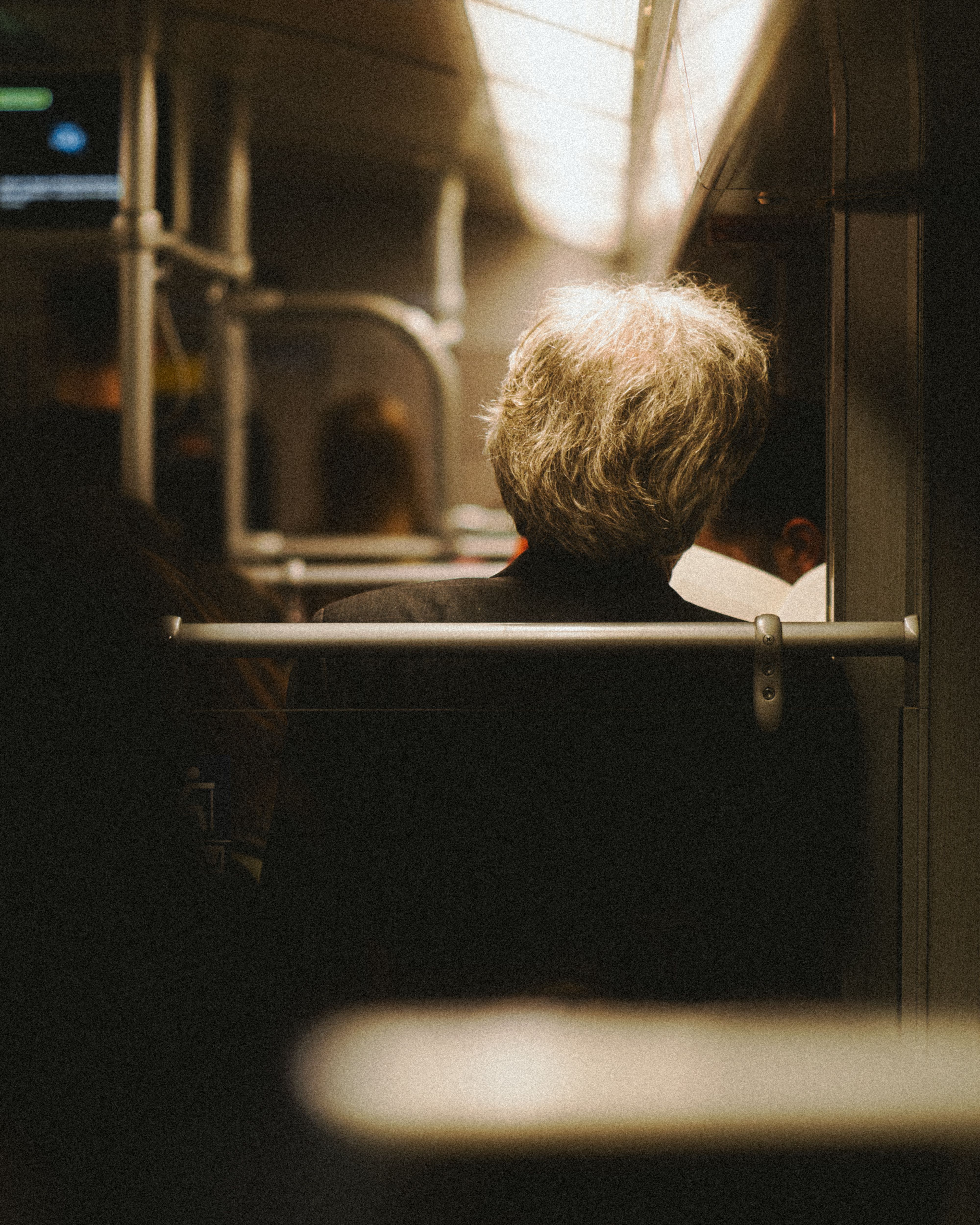 Back View of Man Sitting on Metro Train · Free Stock Photo