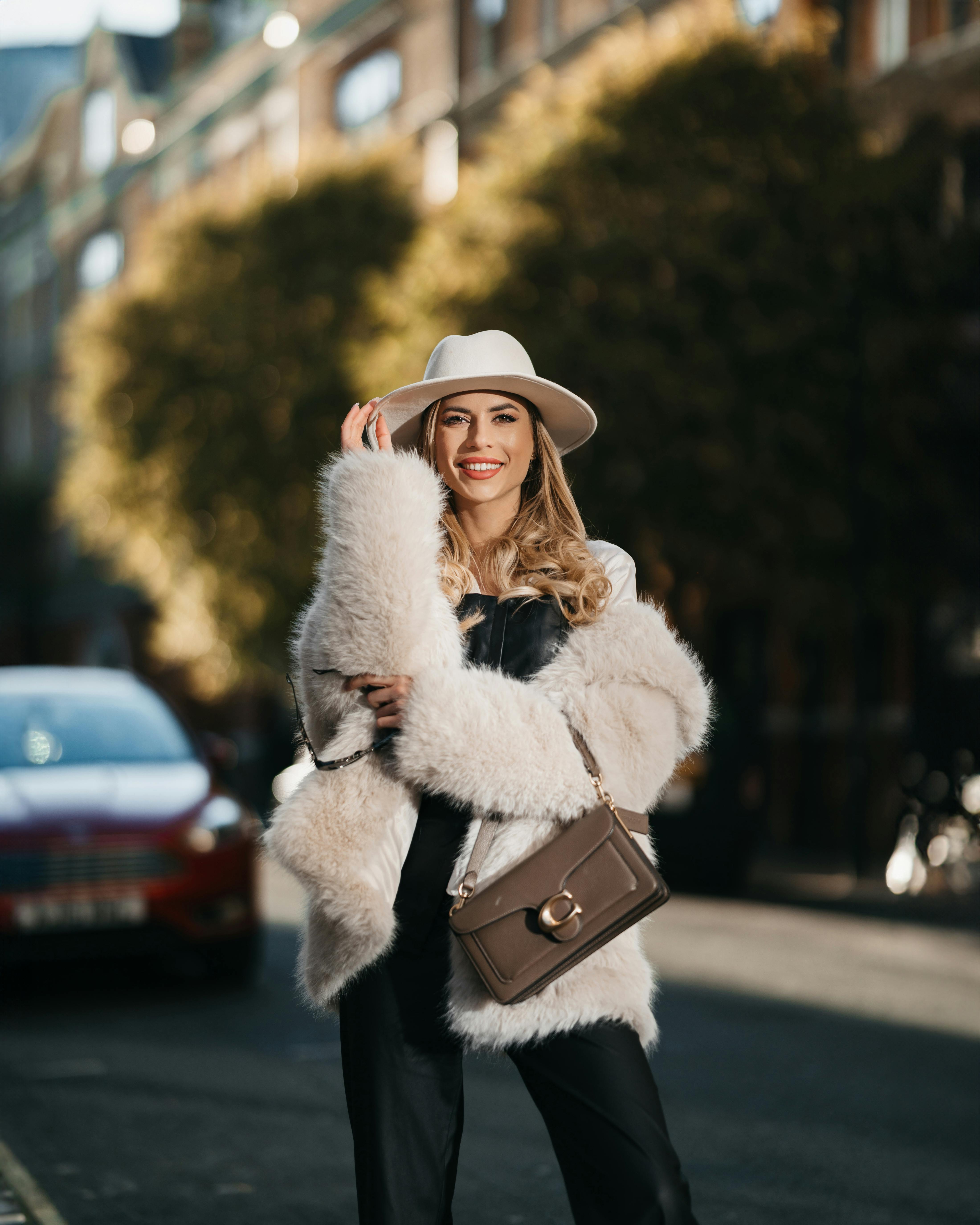 Blonde Woman Wearing Fur Coat on a Street · Free Stock Photo