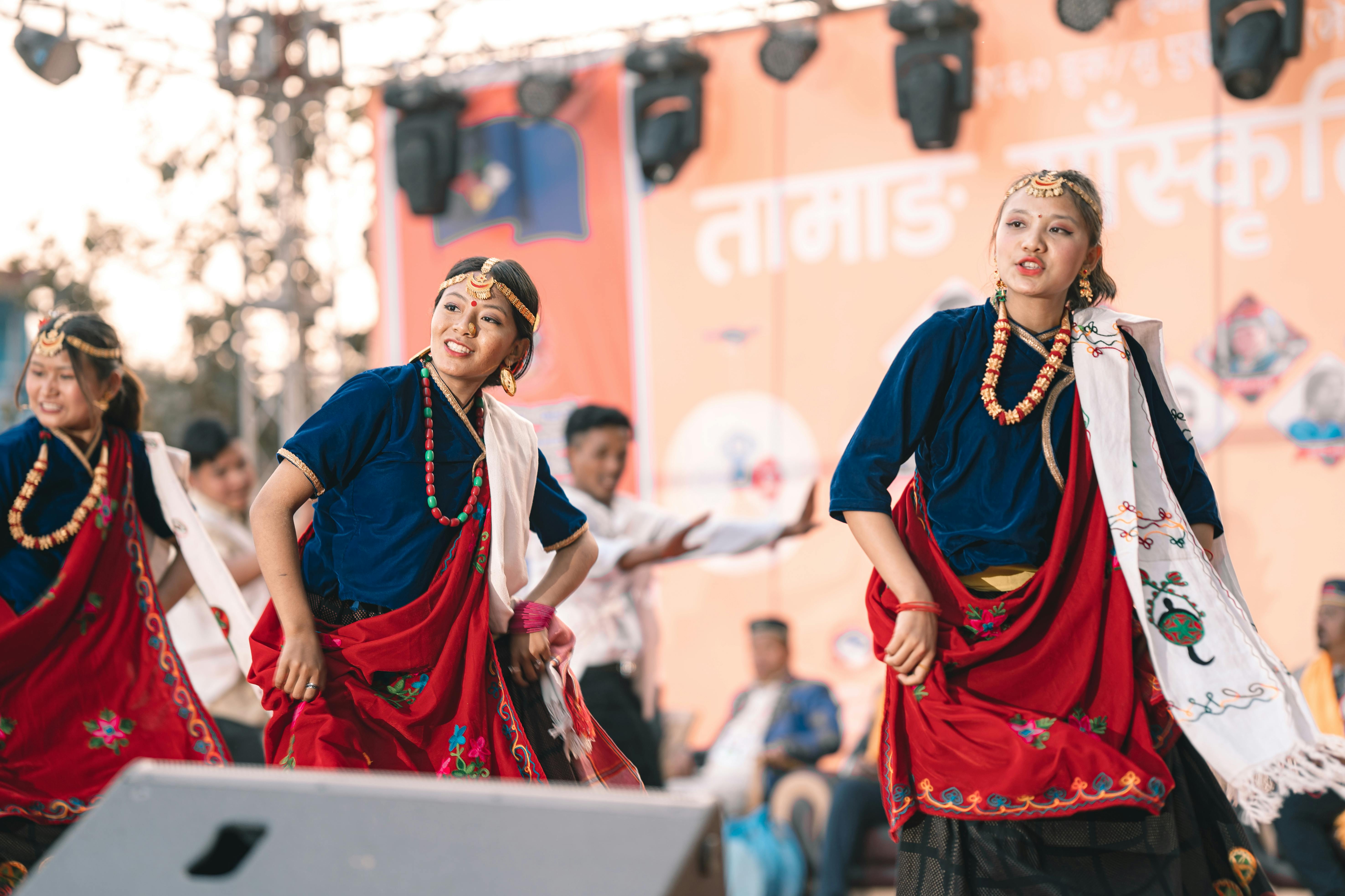 Women in Traditional Dresses Dancing on Stage · Free Stock Photo