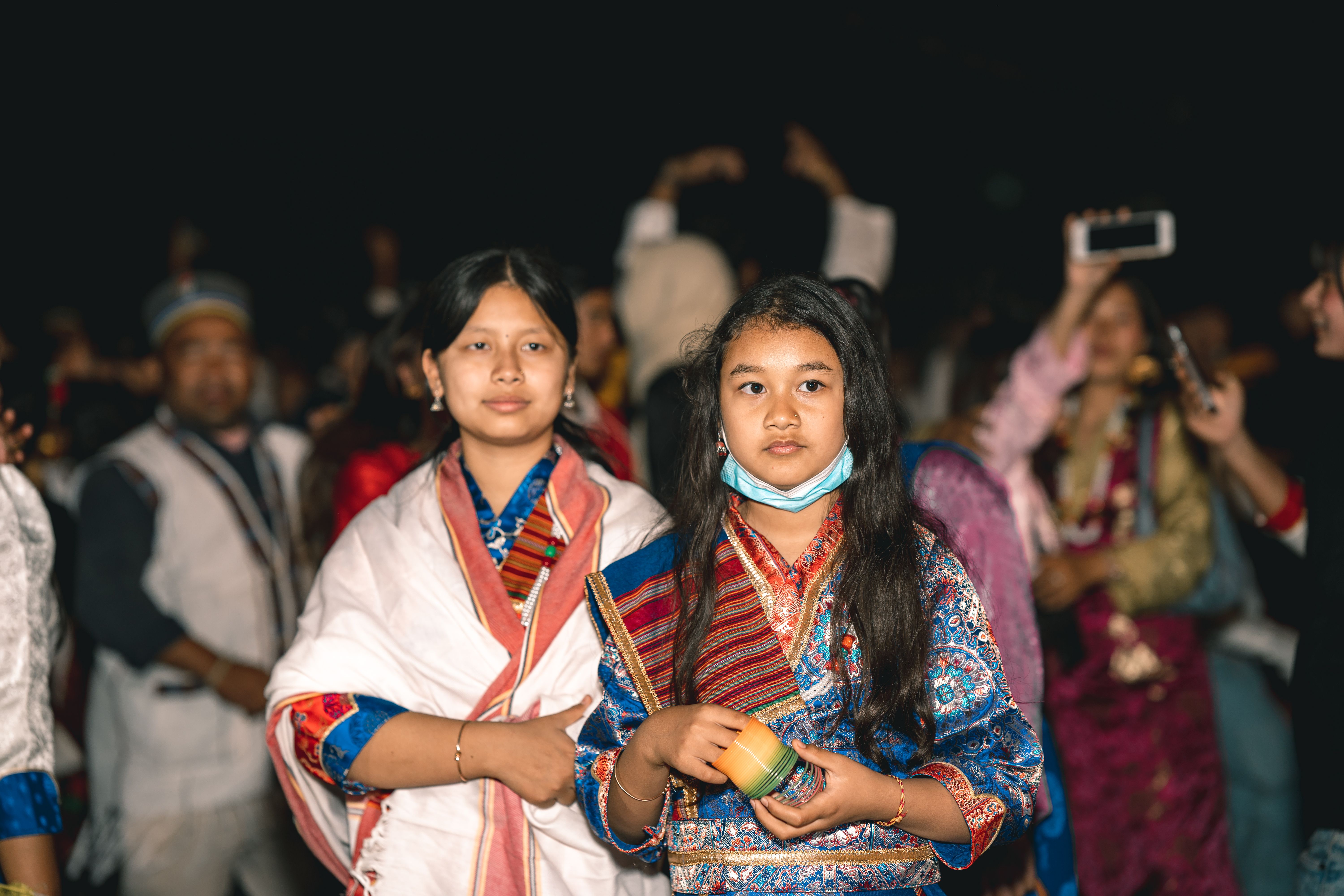 Two young girls in traditional clothing standing together · Free Stock ...