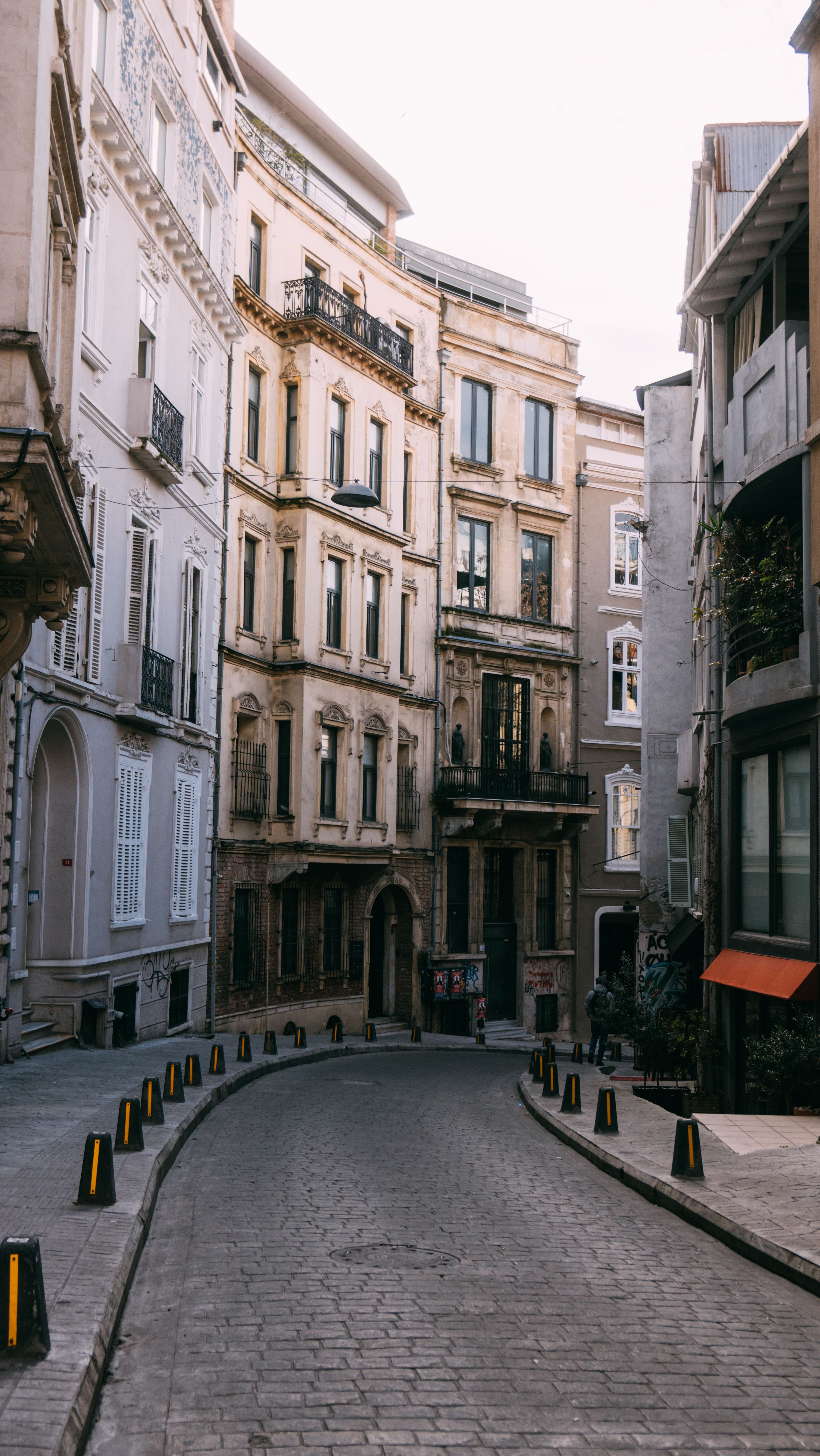 Concrete Road Between Buildings · Free Stock Photo