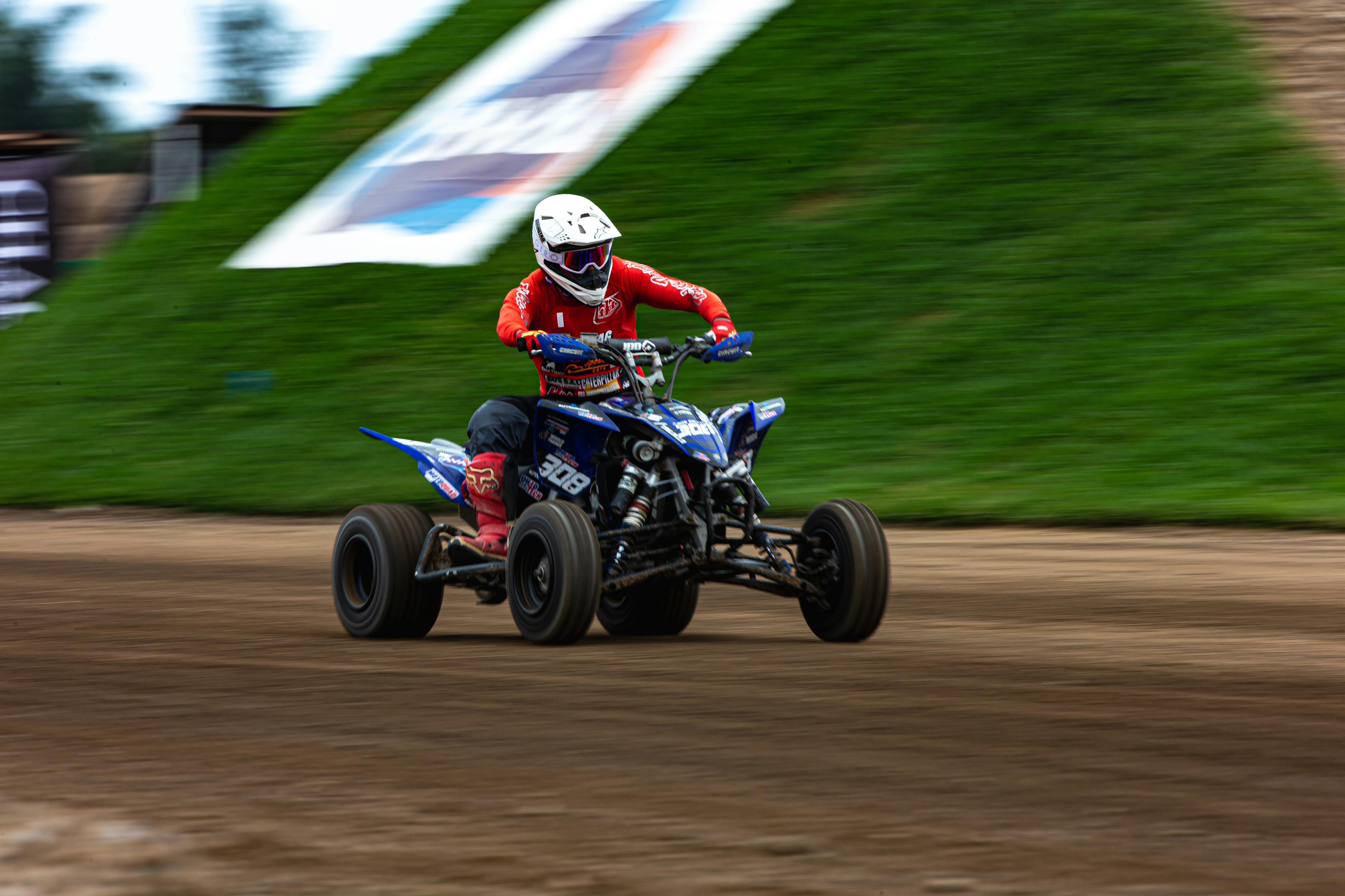 A Man Racing on a Quad Bike · Free Stock Photo