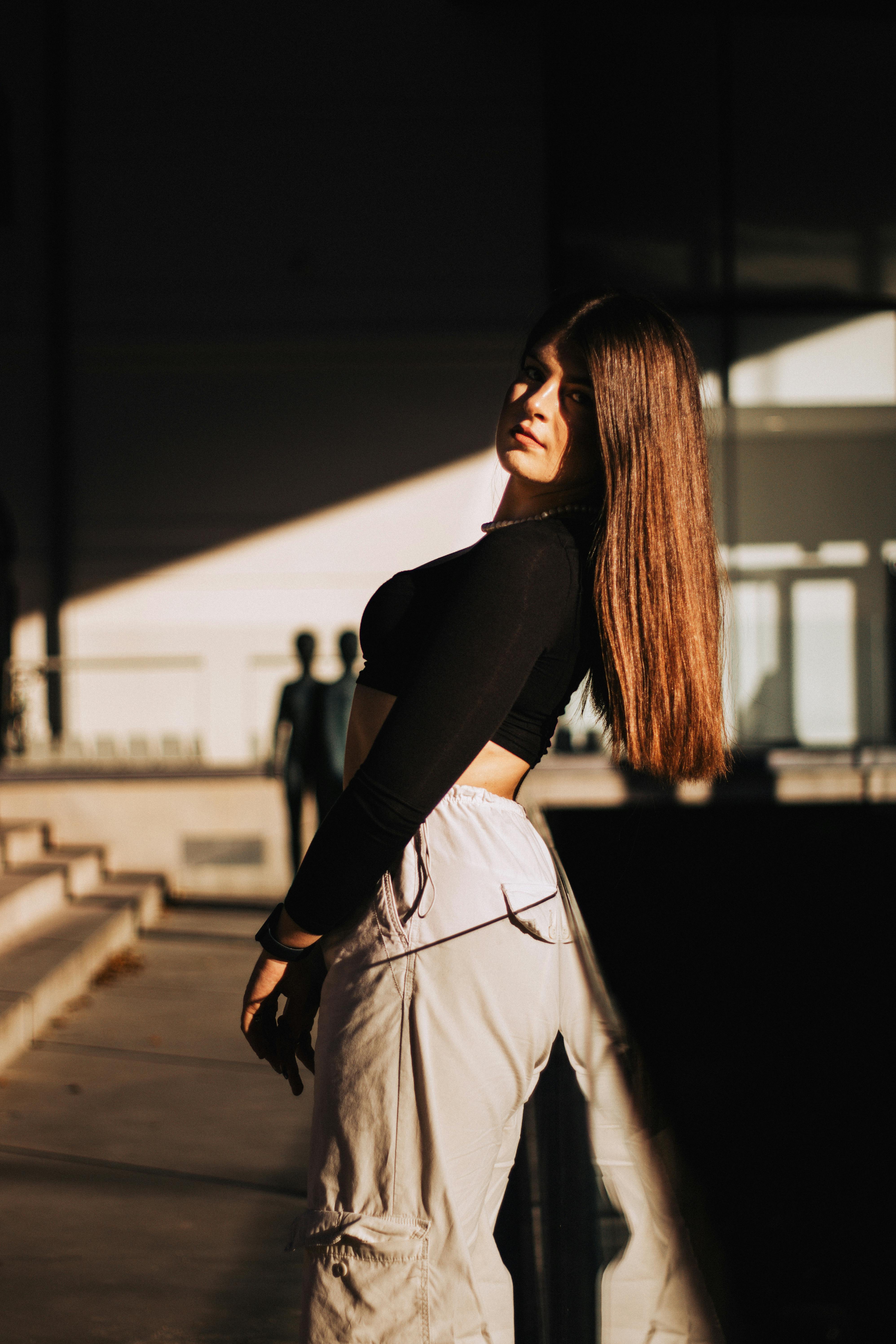 Brunette Woman Posing in Shadow · Free Stock Photo