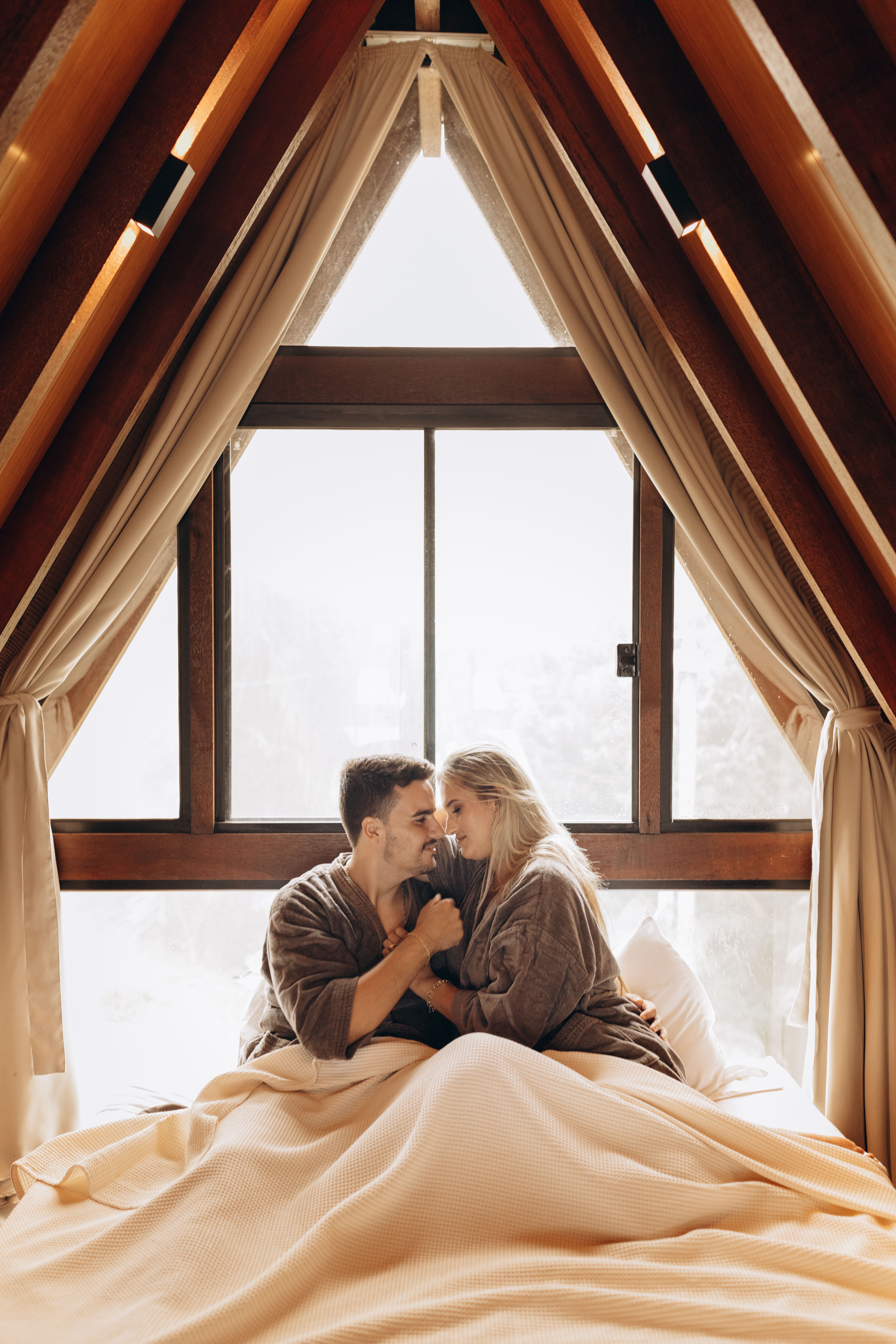 Couple Sitting Together in a Bed · Free Stock Photo