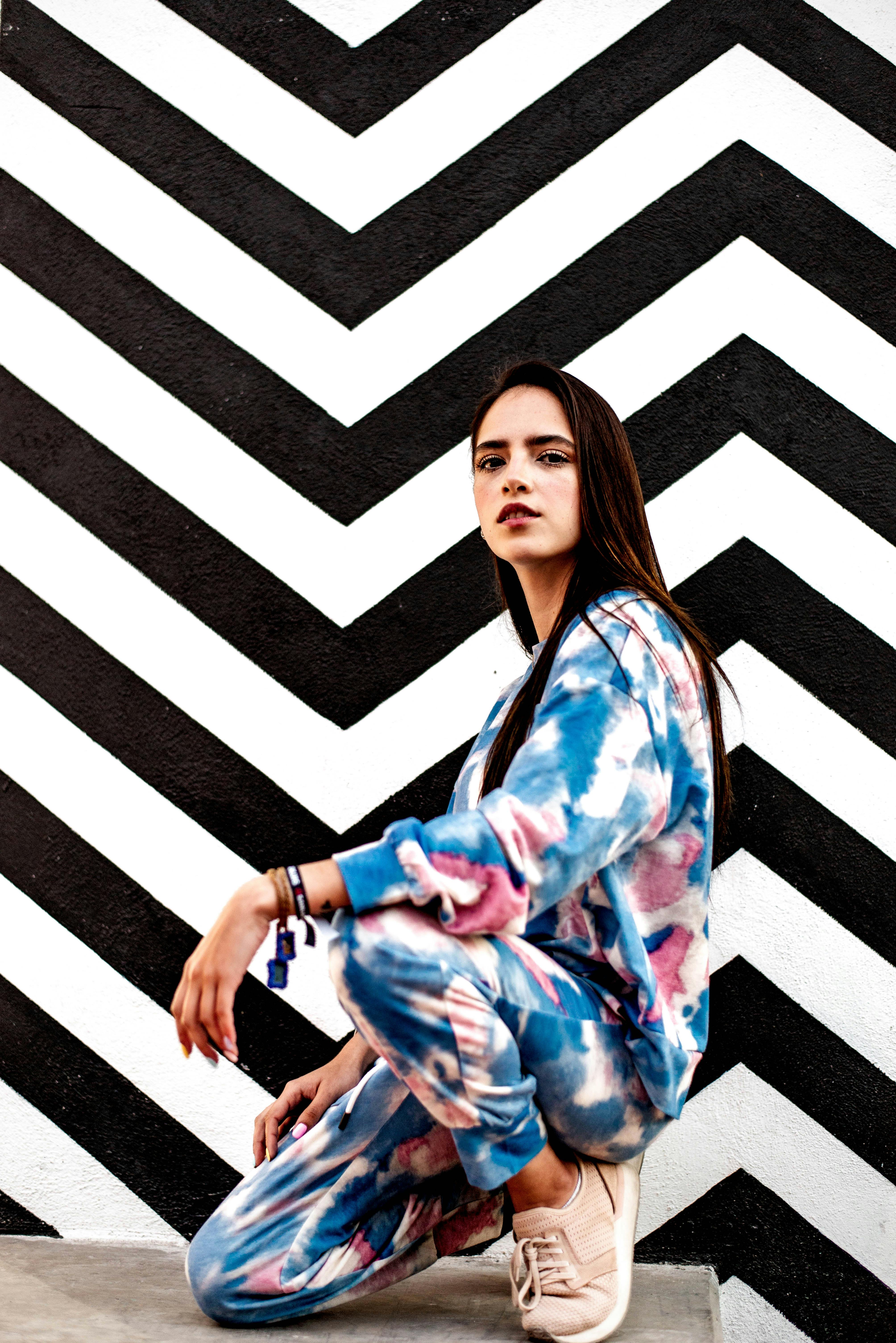 Woman in a Colorful Tracksuit and Trainers · Free Stock Photo