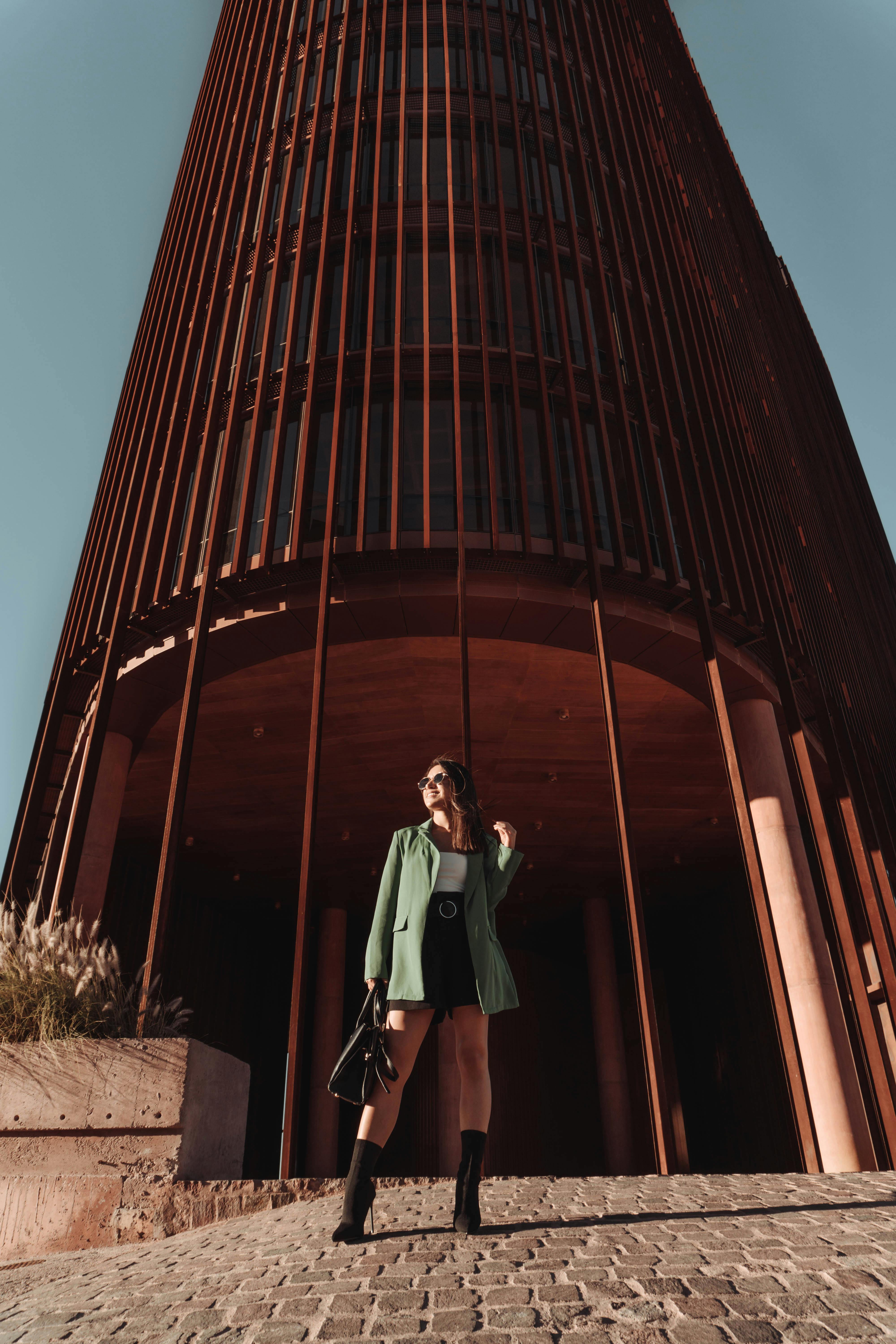 Female Model Standing in Front of the Torre Avancer · Free Stock Photo