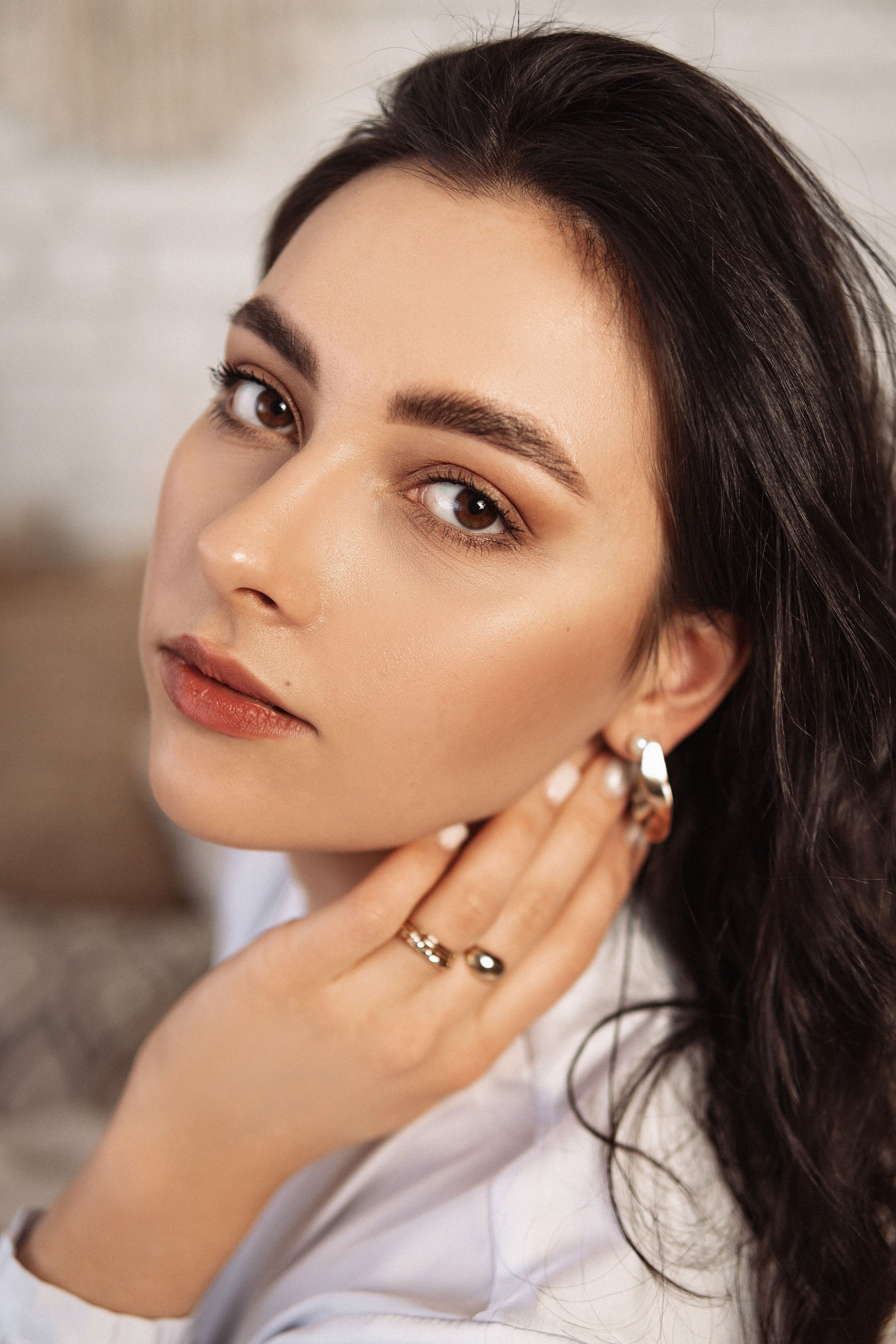 Young Woman Touching Her Neck · Free Stock Photo