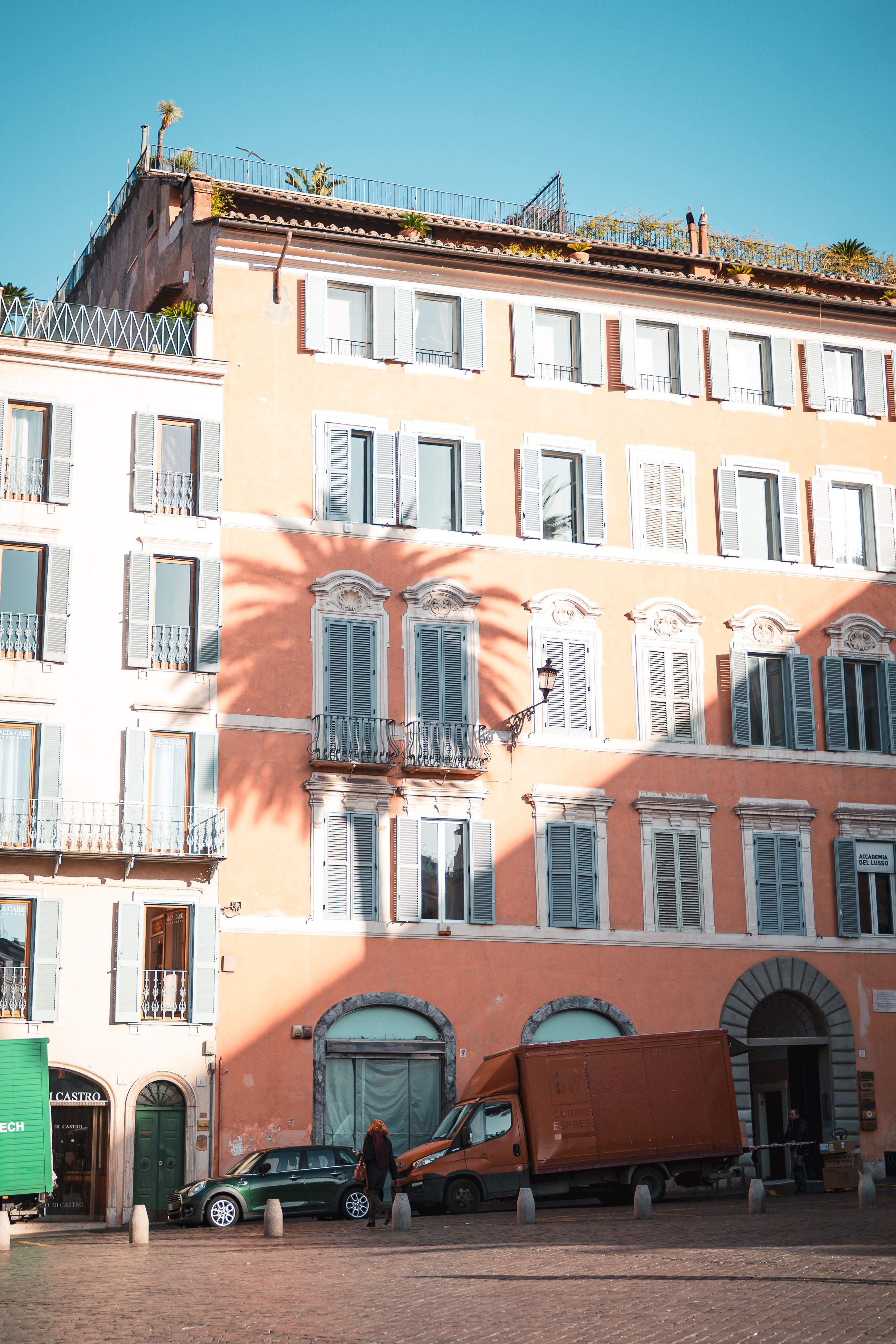 Palm Tree Casting a Shadow on a Residential Building in City · Free ...