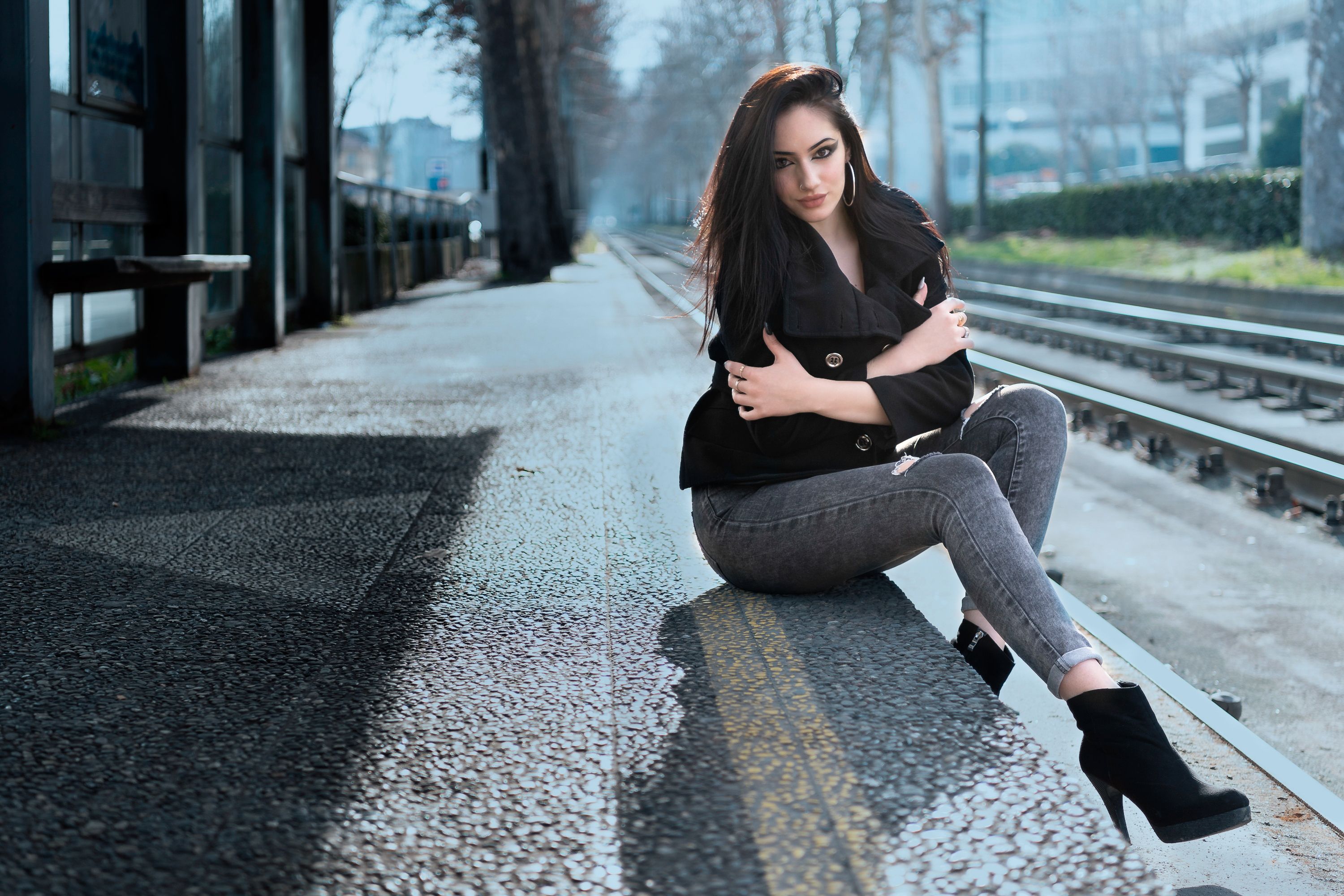 Woman Sitting on Post · Free Stock Photo