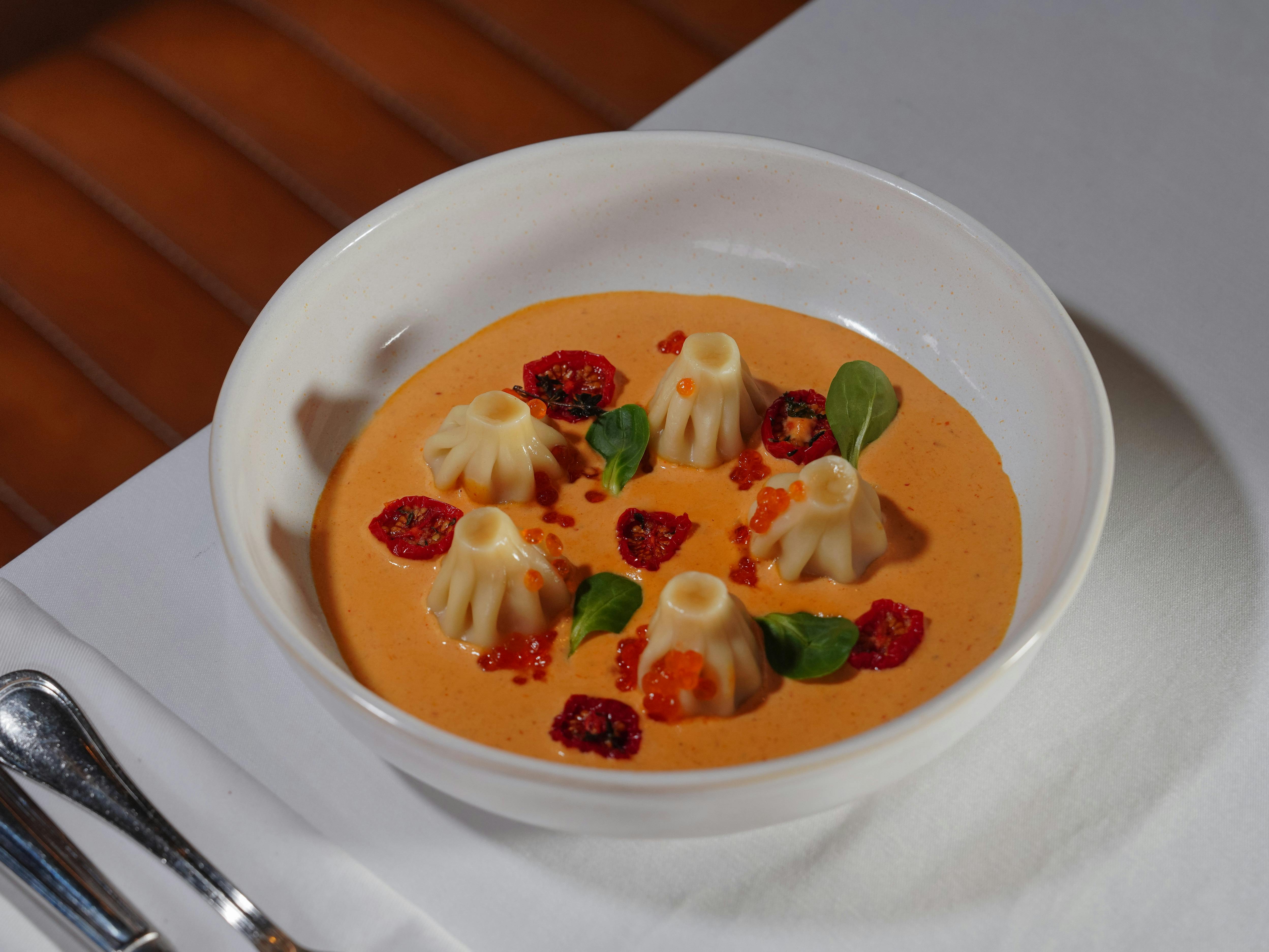 Tomato Soup Served with Dumplings in Deep Bowl · Free Stock Photo