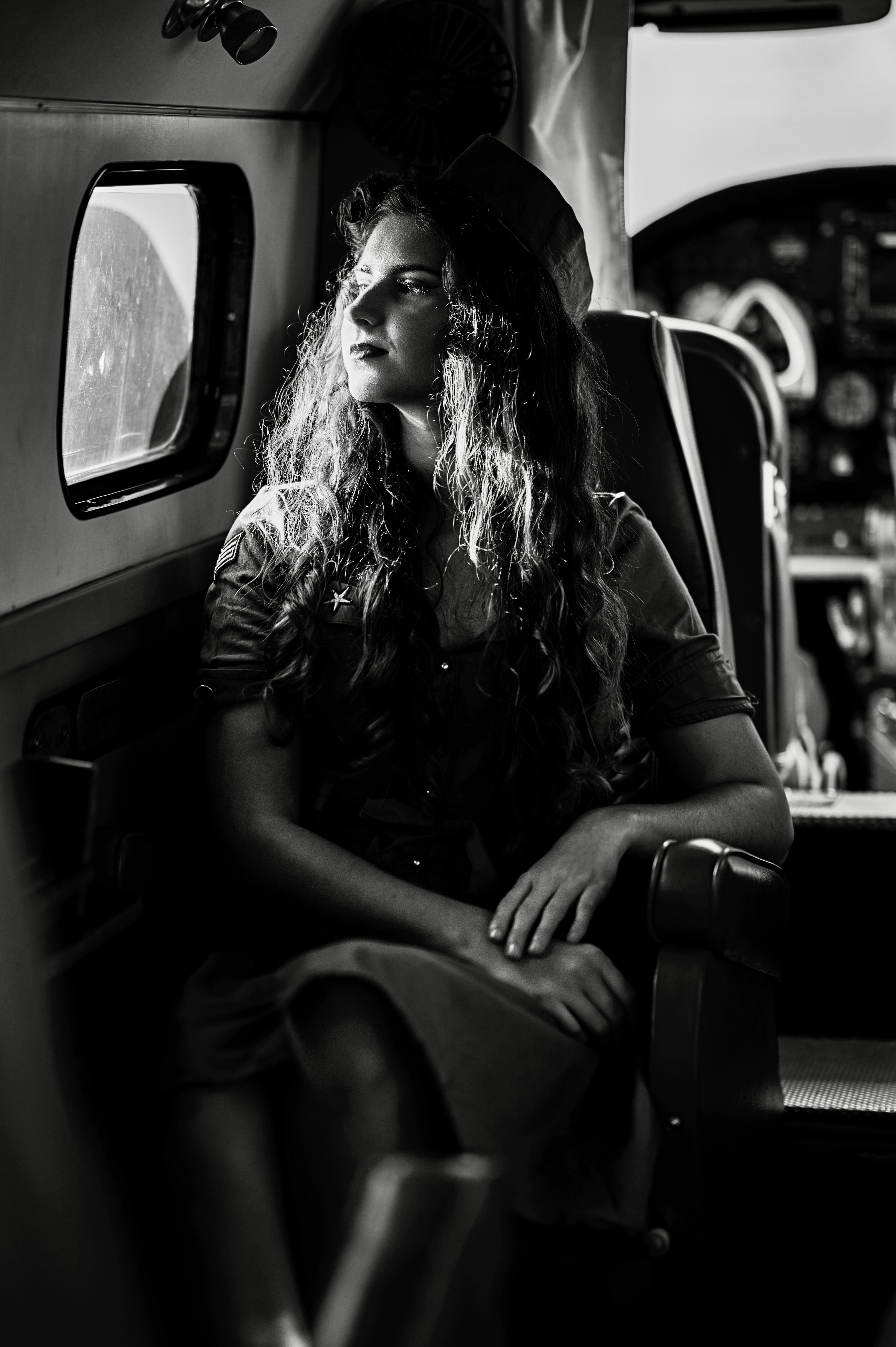 Woman in Hat Sitting on Seat · Free Stock Photo