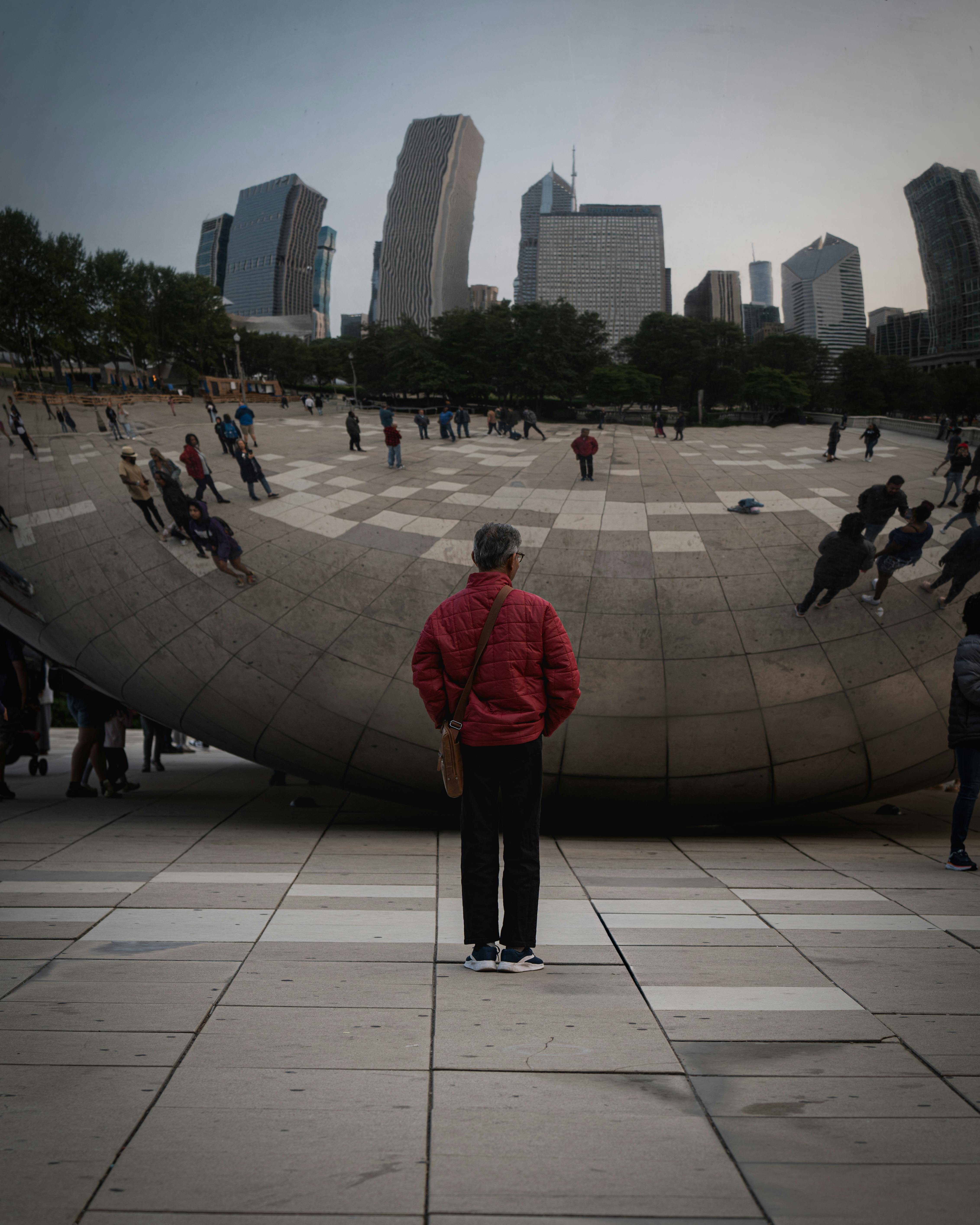 Back View of a Man Standing in Front of the Cloud Gate Sculpture in ...