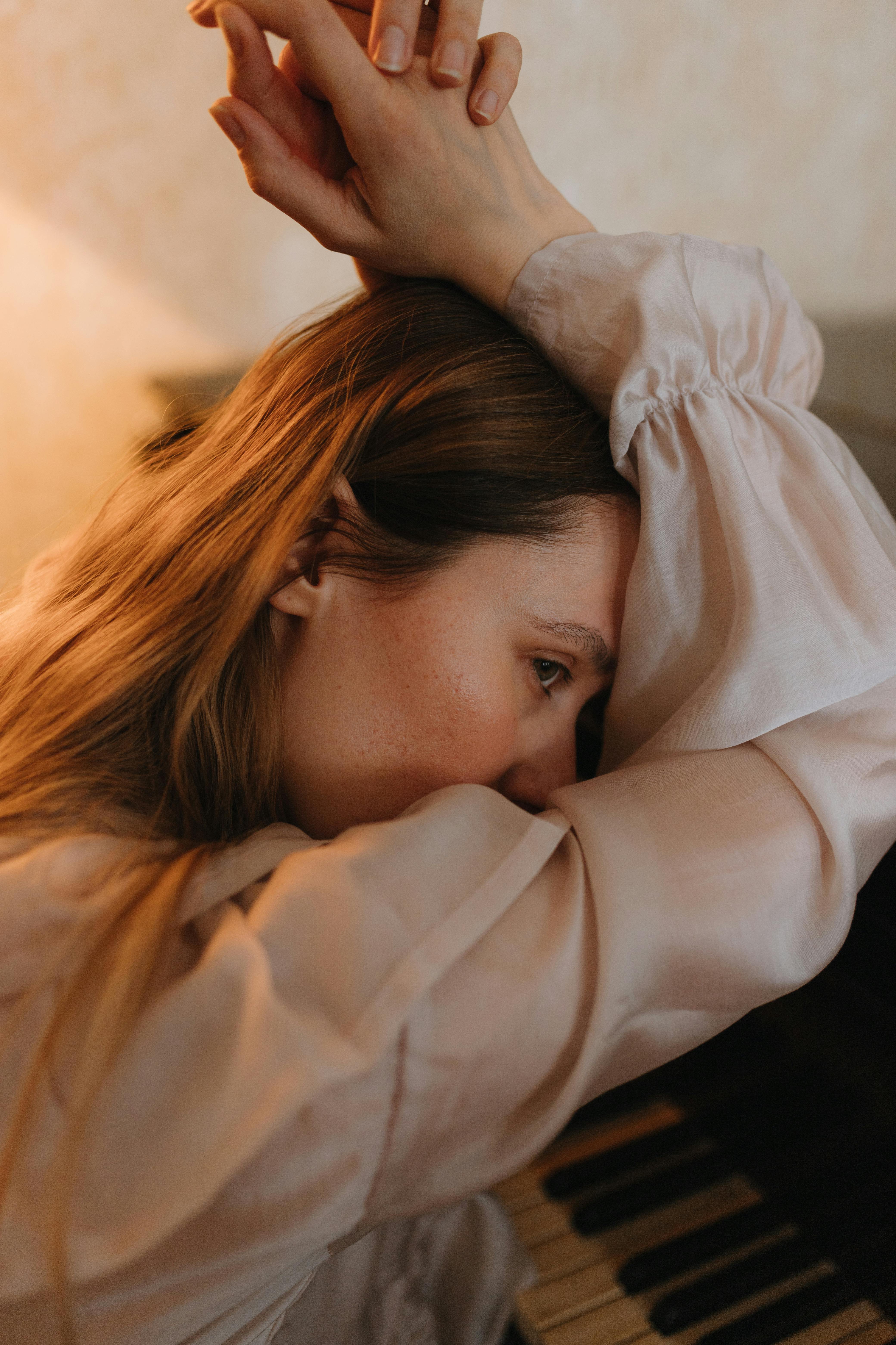 Woman Resting Arm on Piano · Free Stock Photo