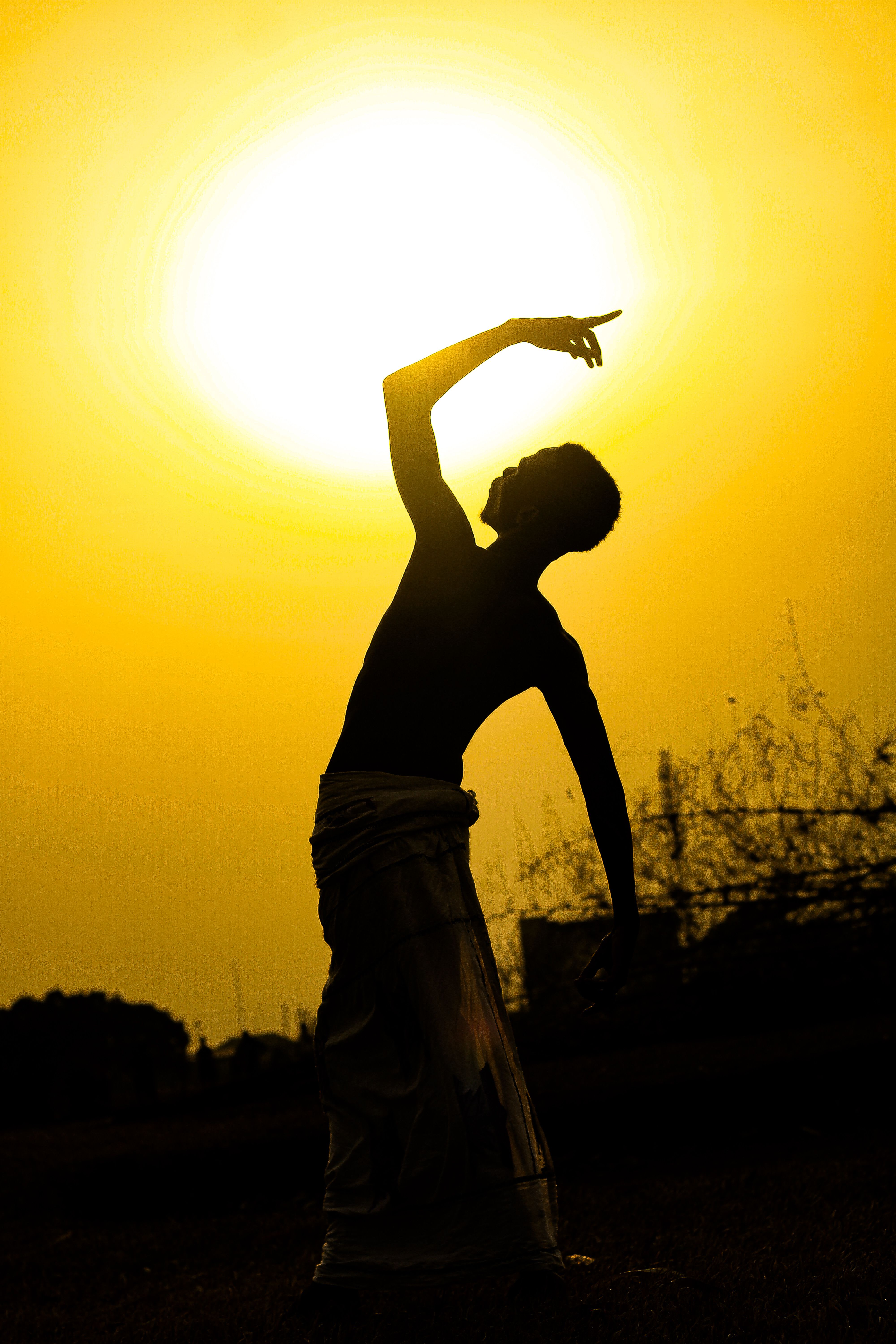 Silhouette of Person Posing under Sun at Sunset on Yellow Sky · Free ...