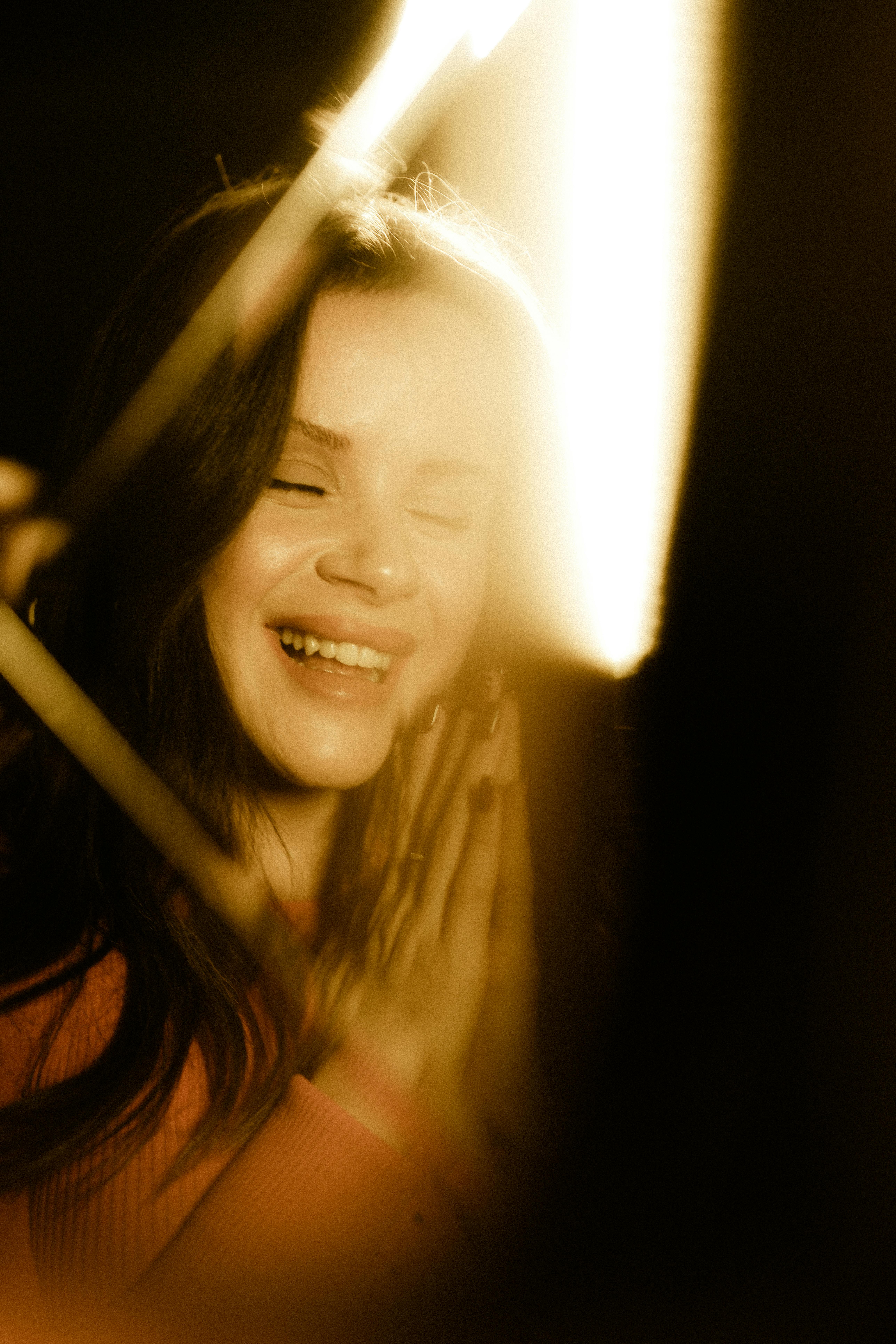 Sunlit Woman Face in Darkness · Free Stock Photo