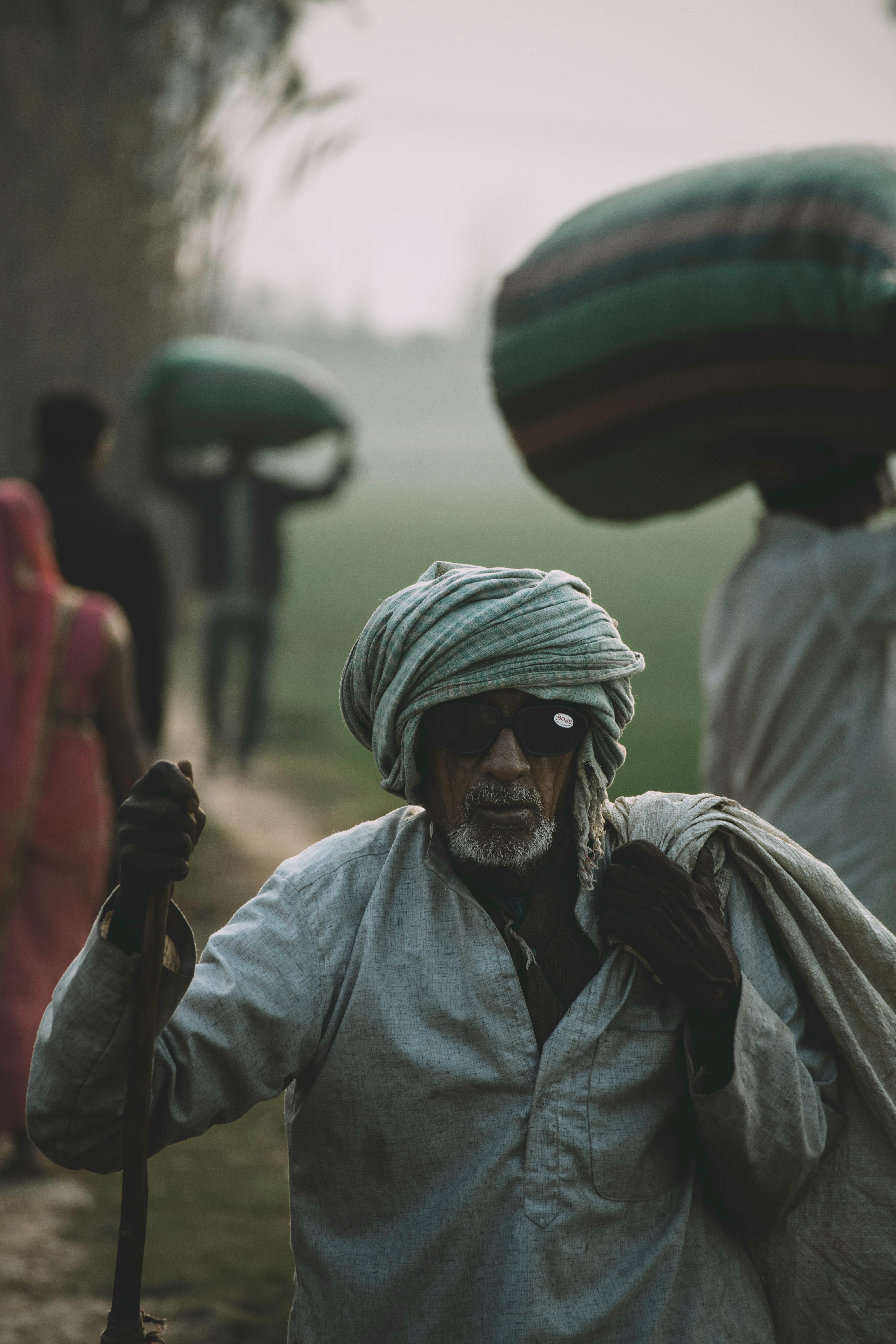 Senior Man Carrying a Sack · Free Stock Photo