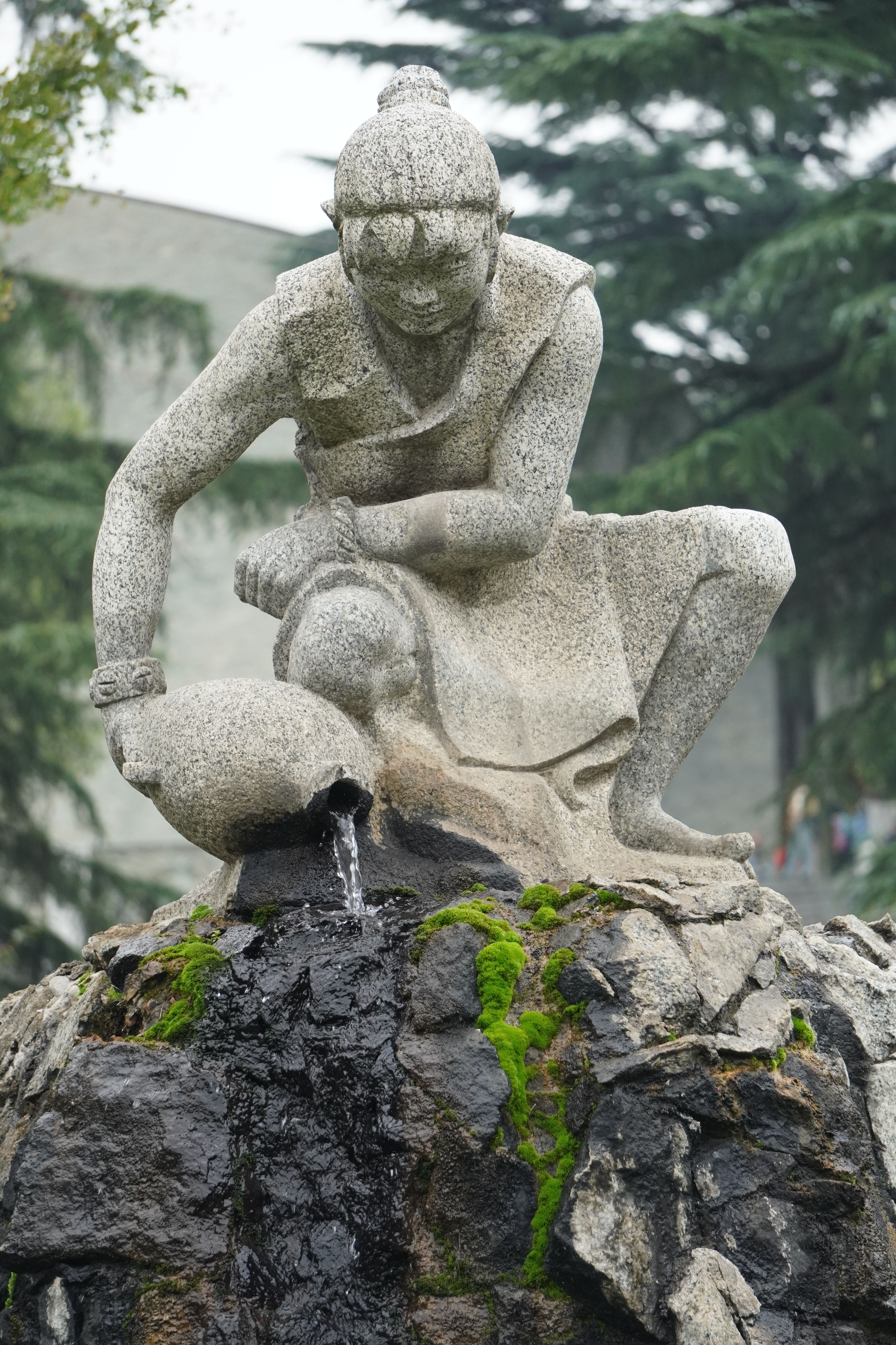 A Statue of a Woman Pouring Water · Free Stock Photo