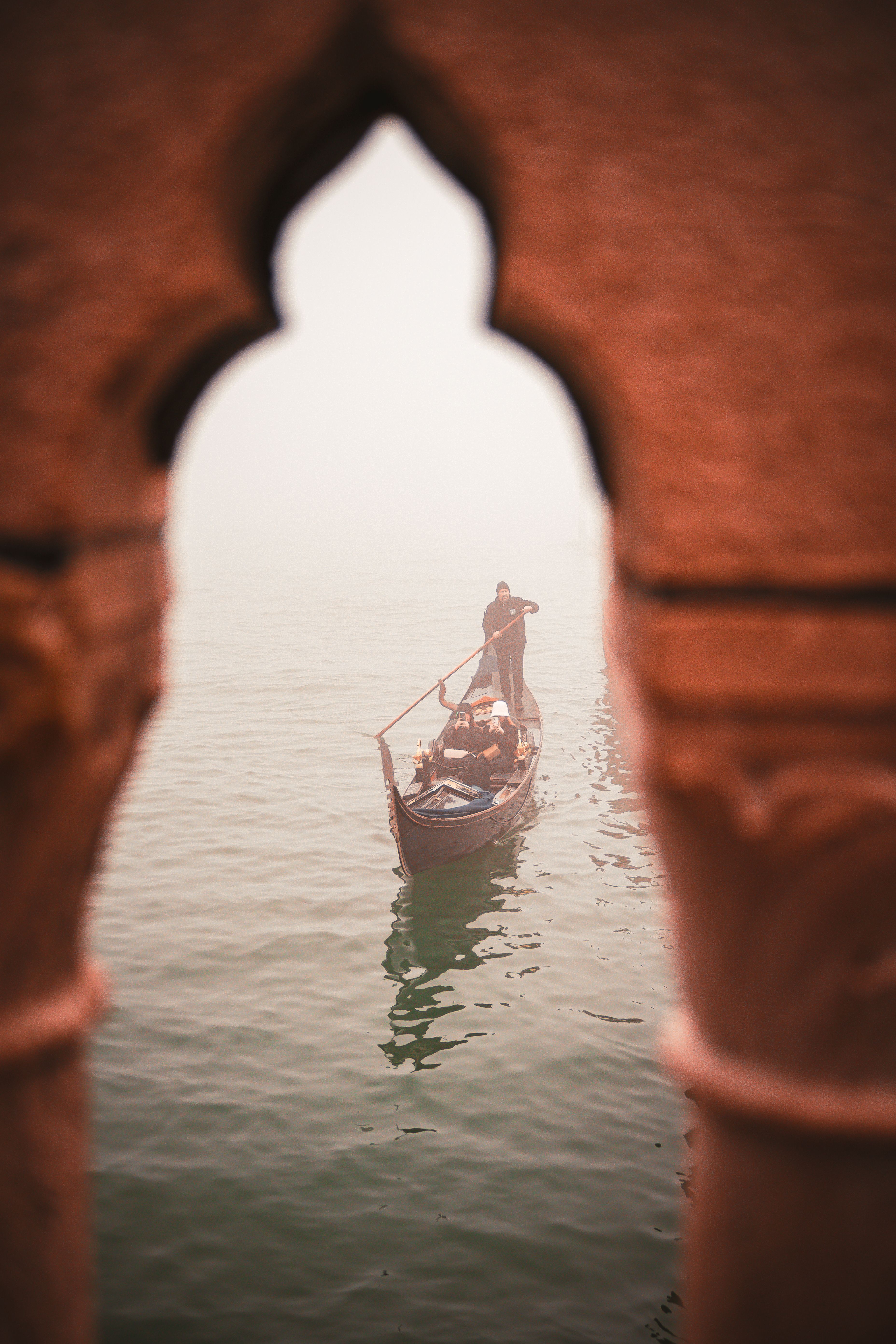 Gondola under Fog behind Gap in Wall · Free Stock Photo