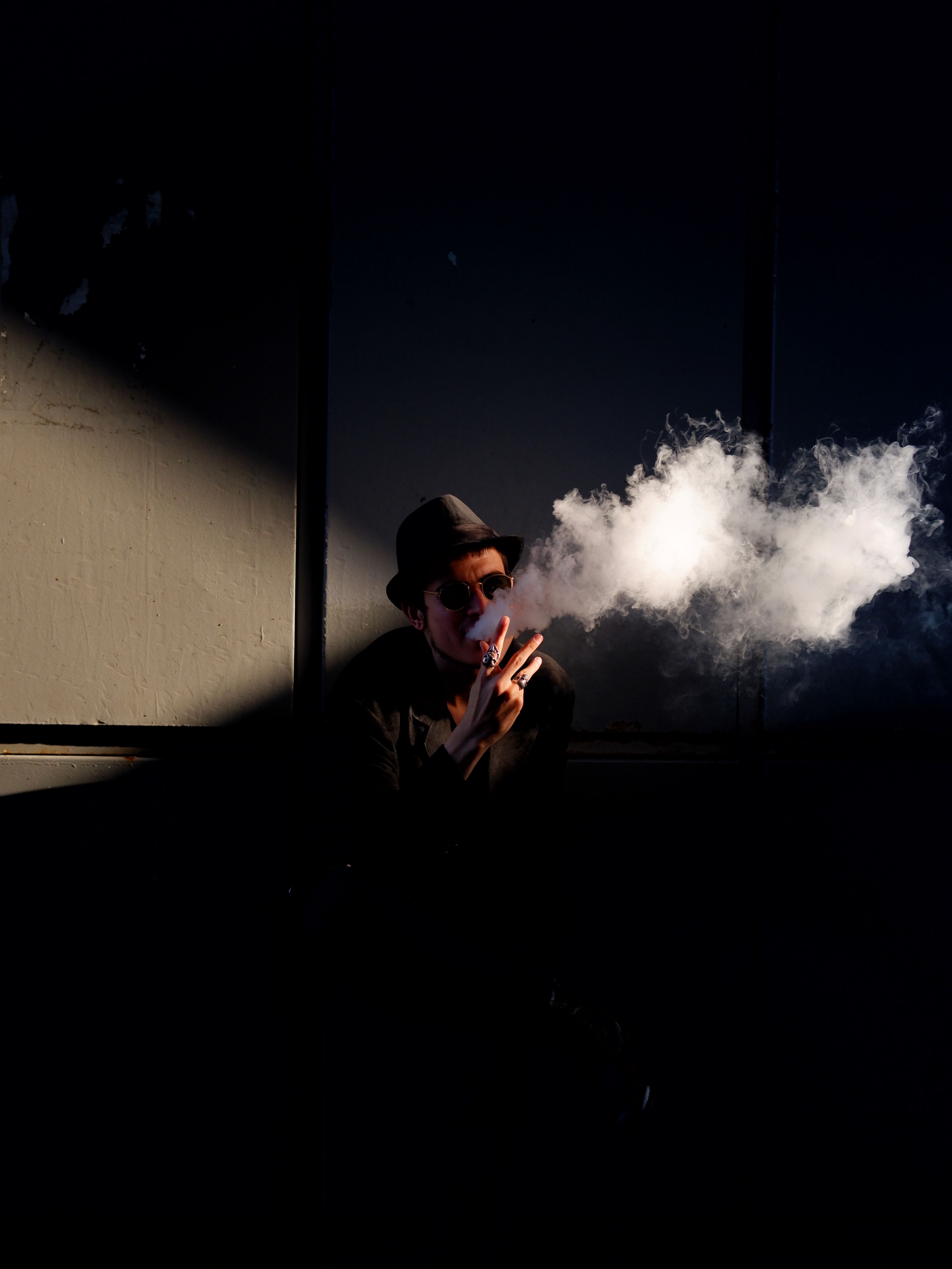 Man Smoking in Darkness · Free Stock Photo