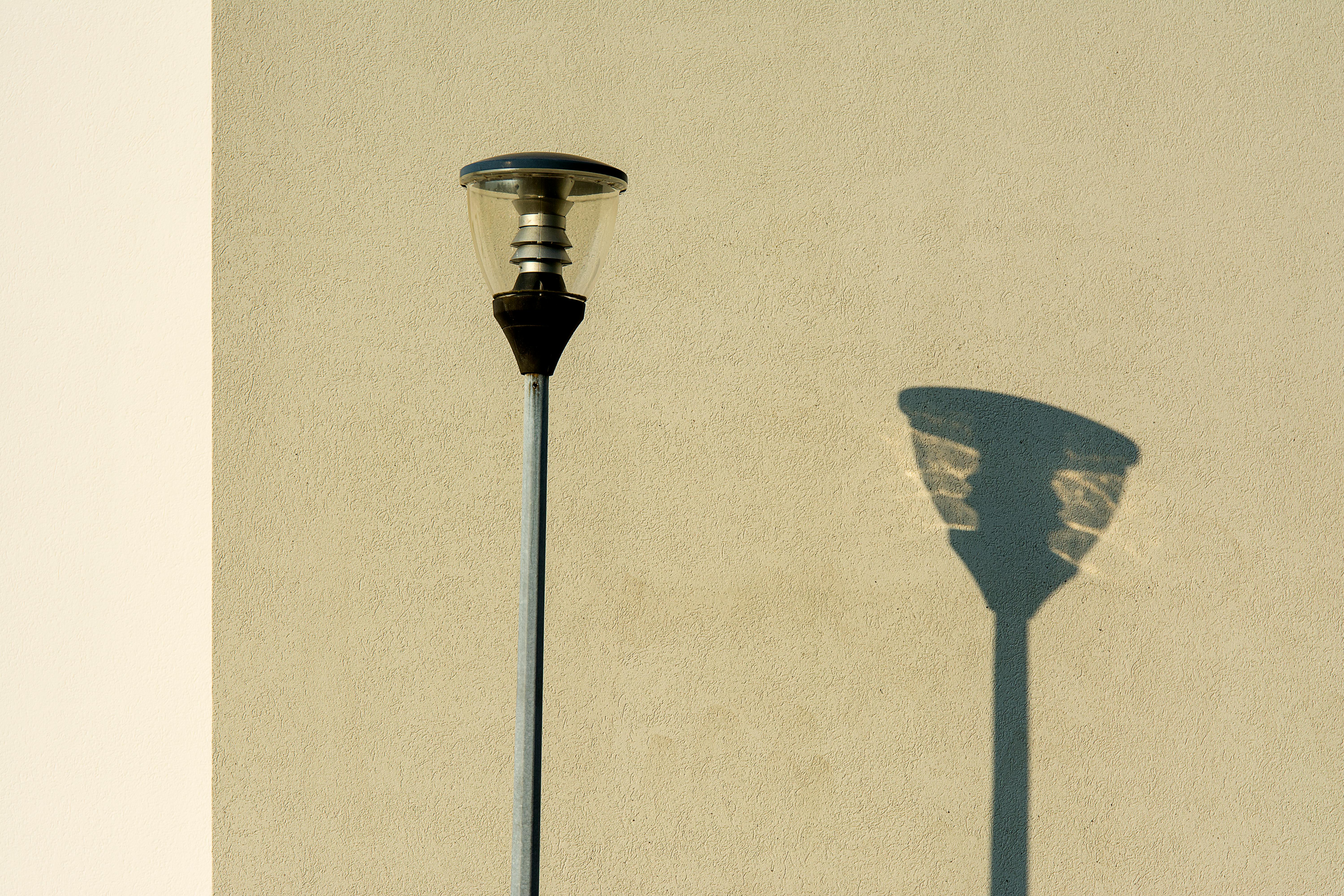 Lamp and Its Shadow on Wall · Free Stock Photo