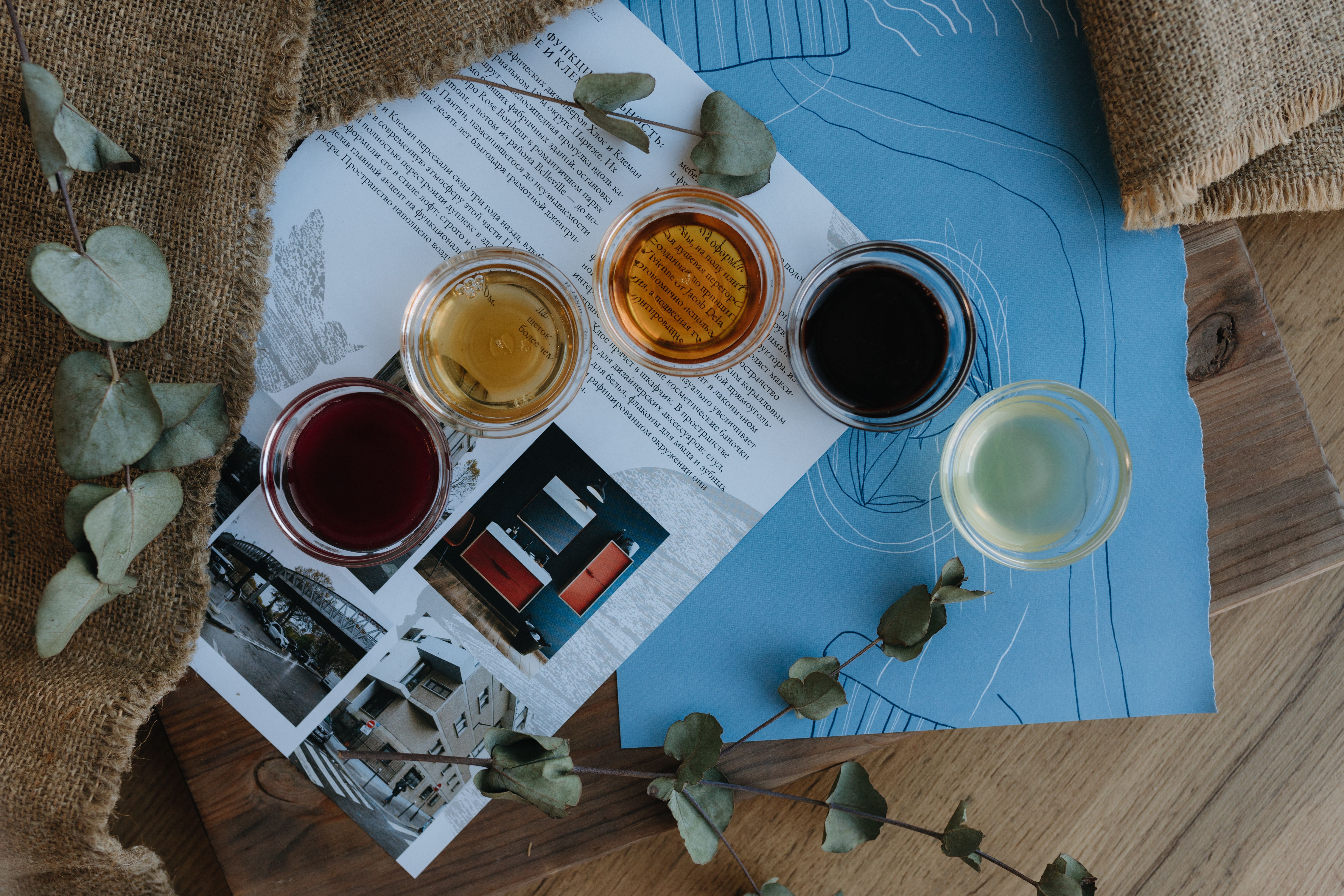 Leaves around Small Bowls of Liquids · Free Stock Photo