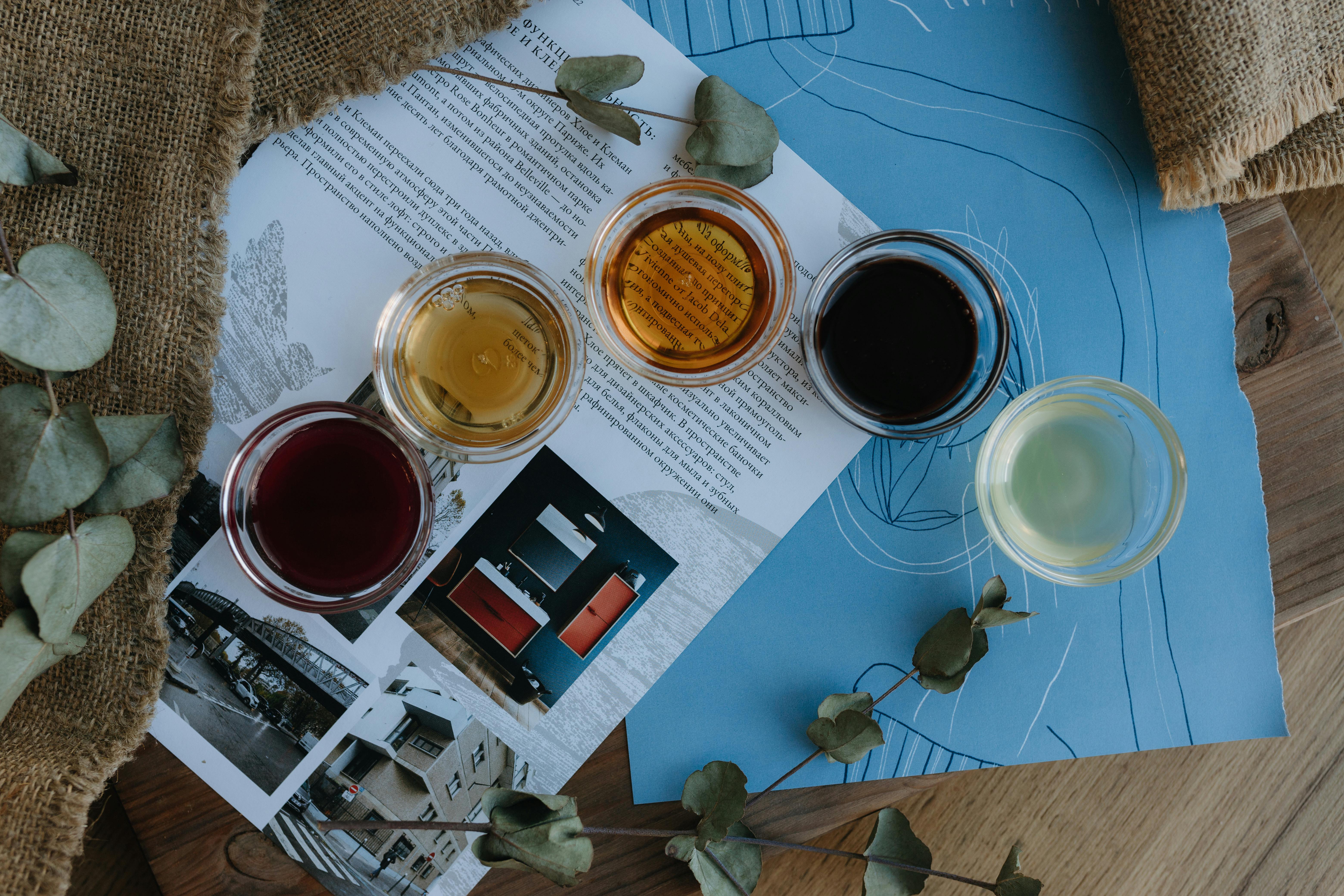 Samples of Drinks on Magazines · Free Stock Photo