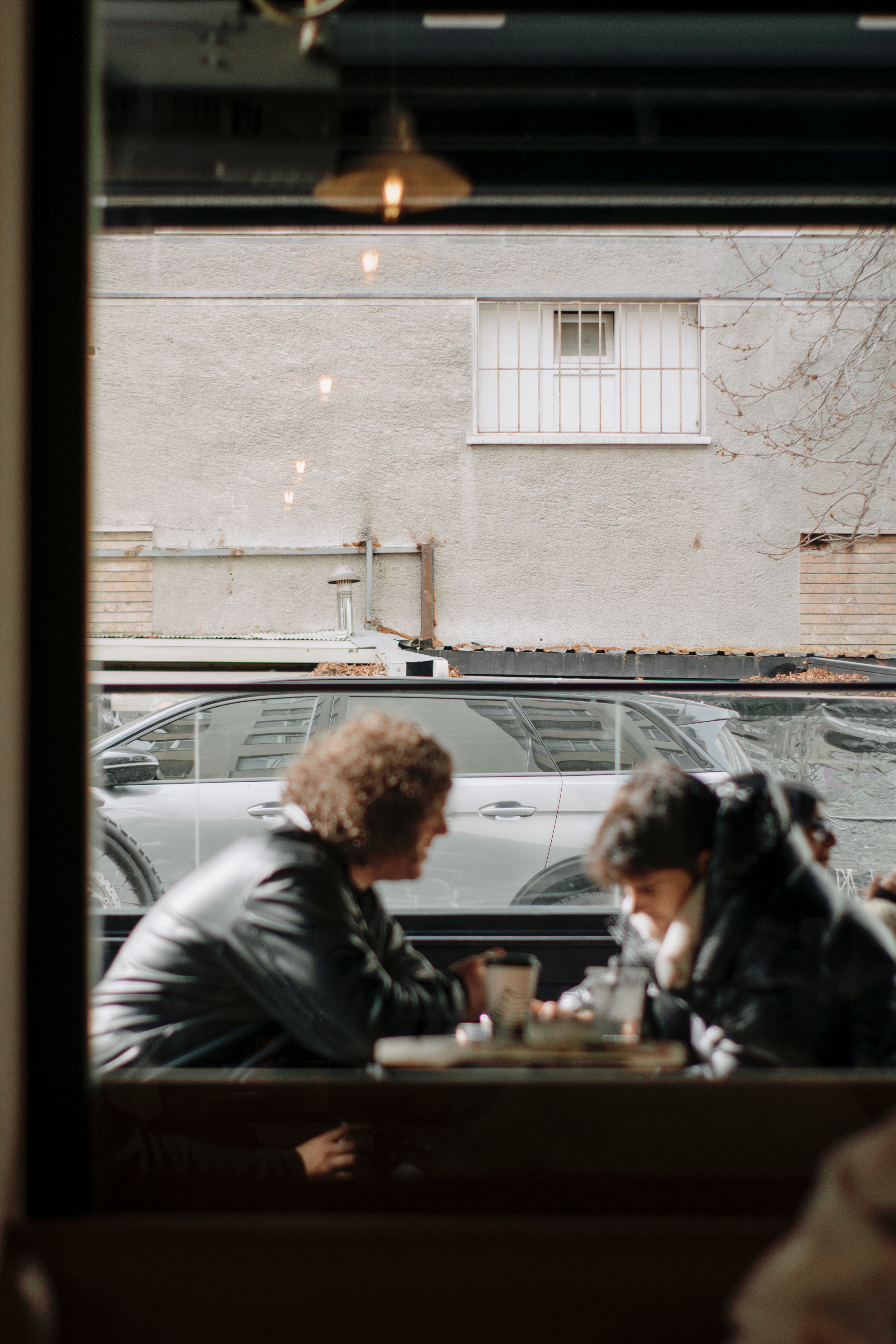 Building behind People Sitting at Cafe · Free Stock Photo