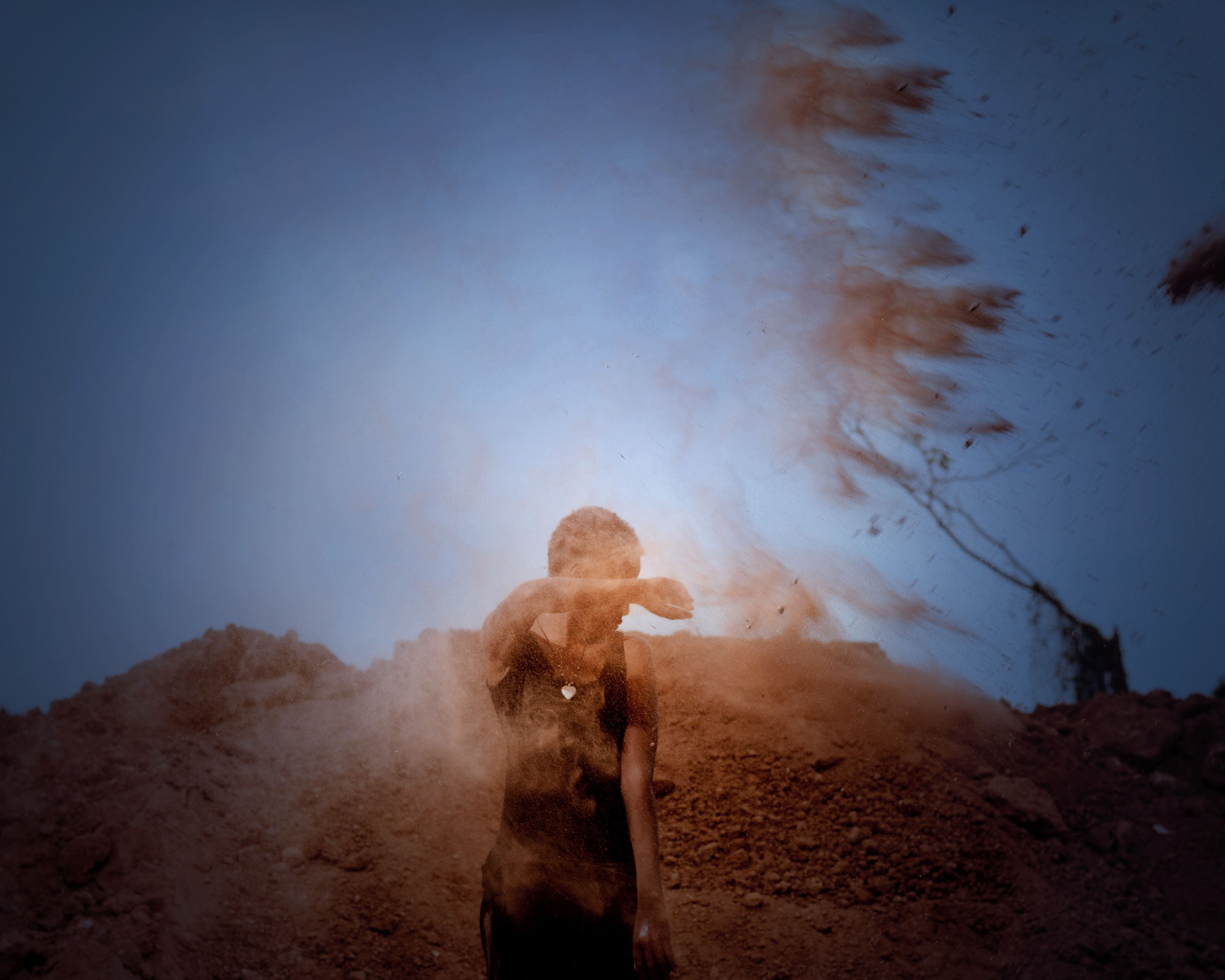 Woman Standing in Desert and Covering from Flying Sand · Free Stock Photo