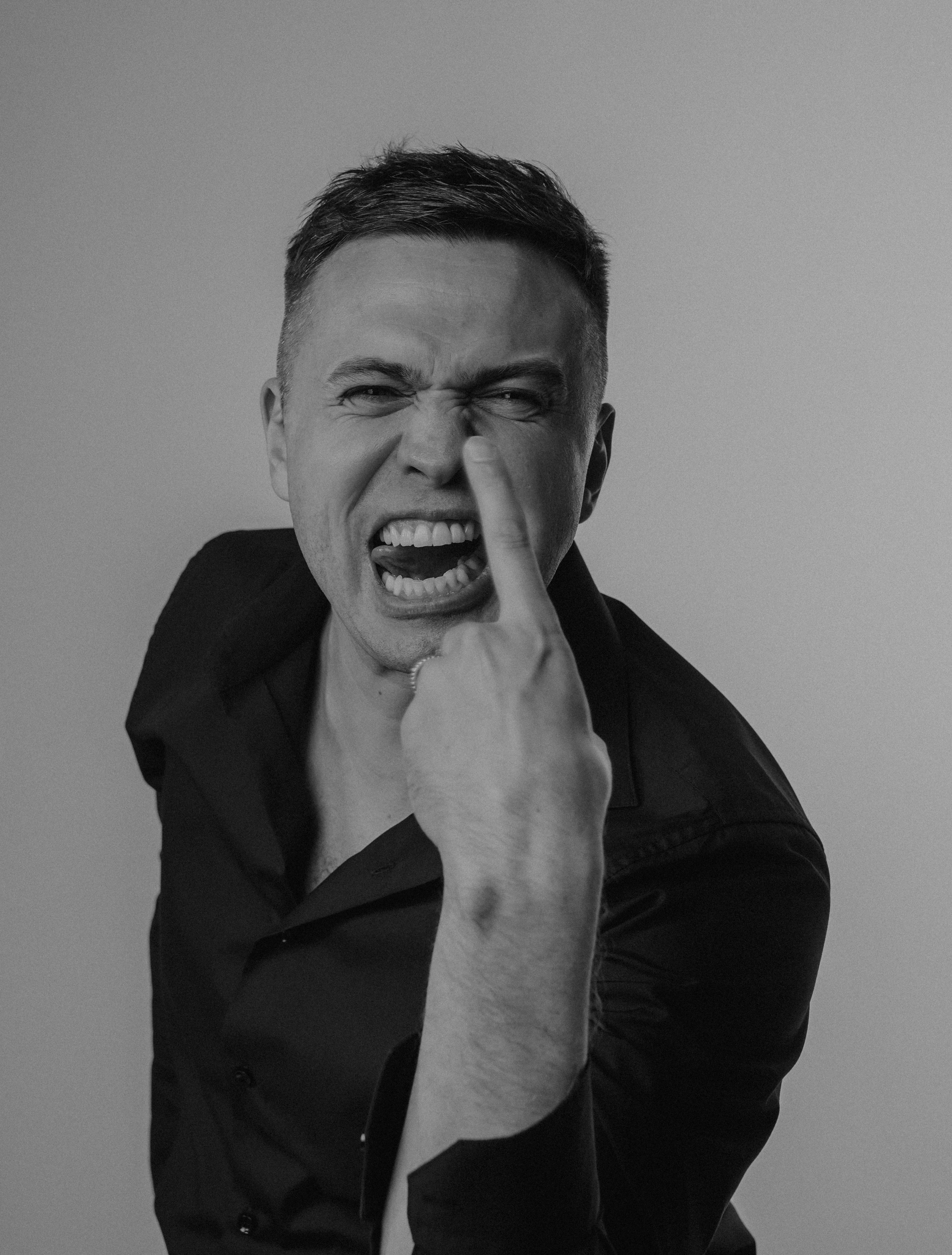 Man Shouting with Finger Raised · Free Stock Photo