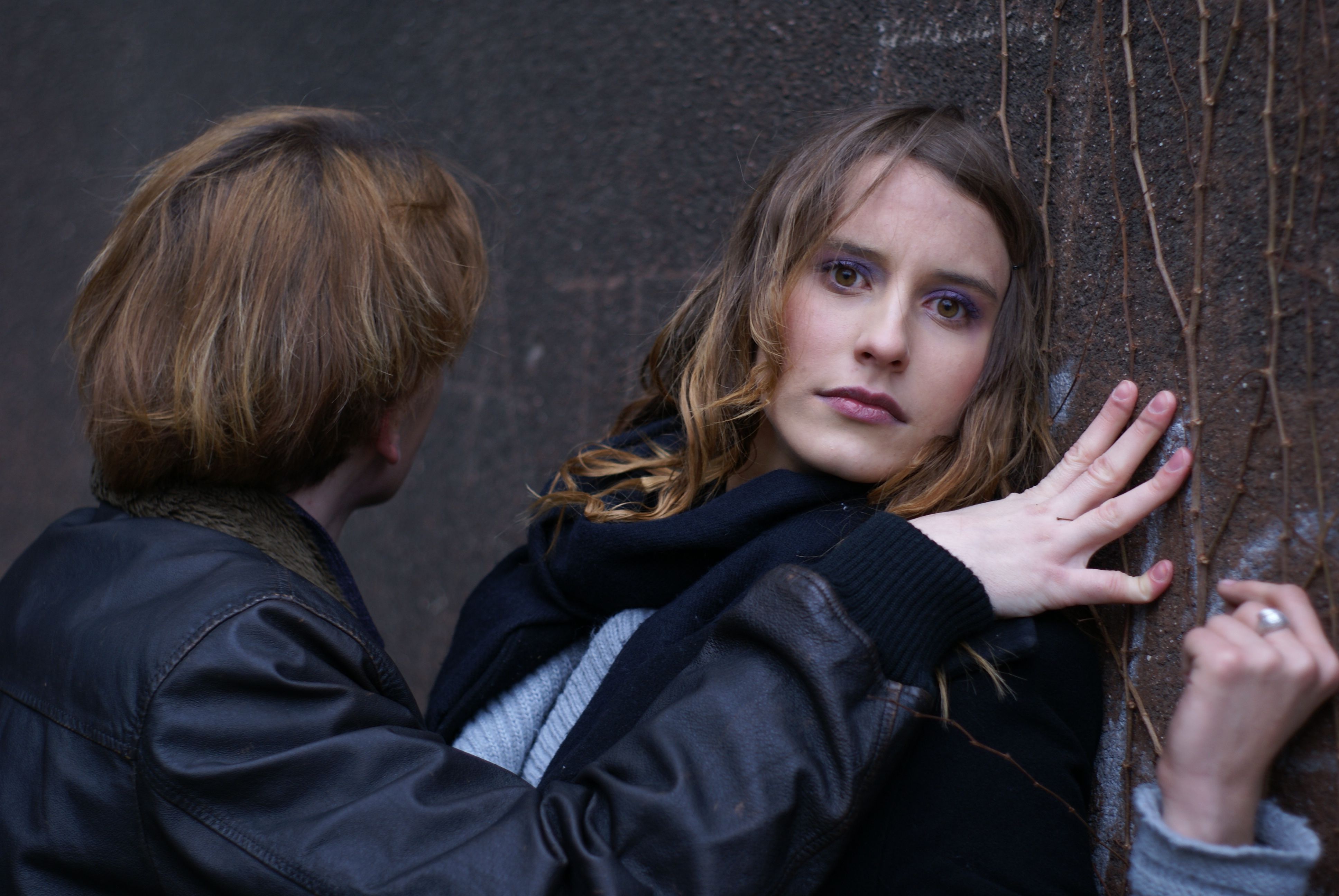 A woman is touching the hand of another woman · Free Stock Photo