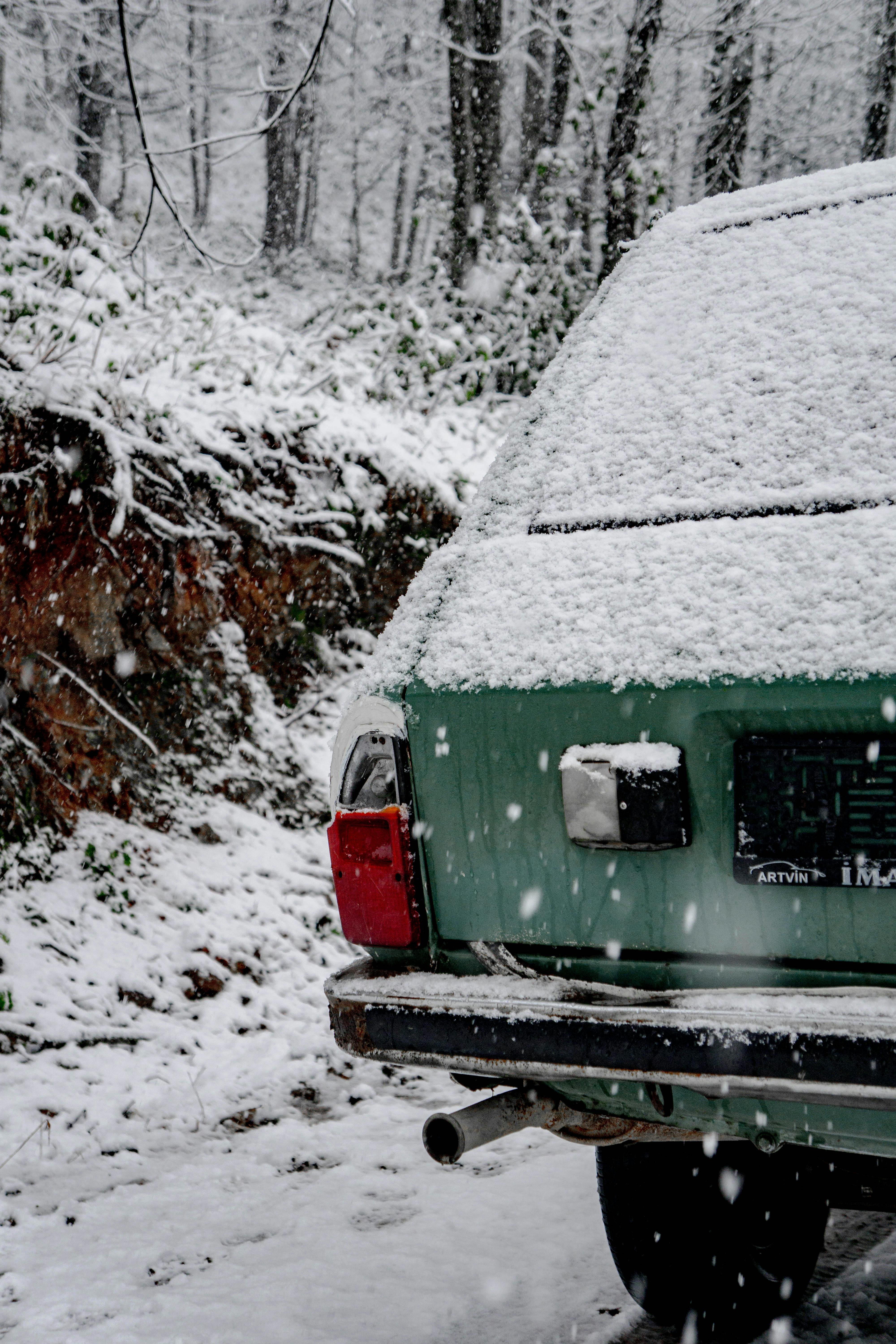 Gray Vehicle With Snow On Roof · Free Stock Photo