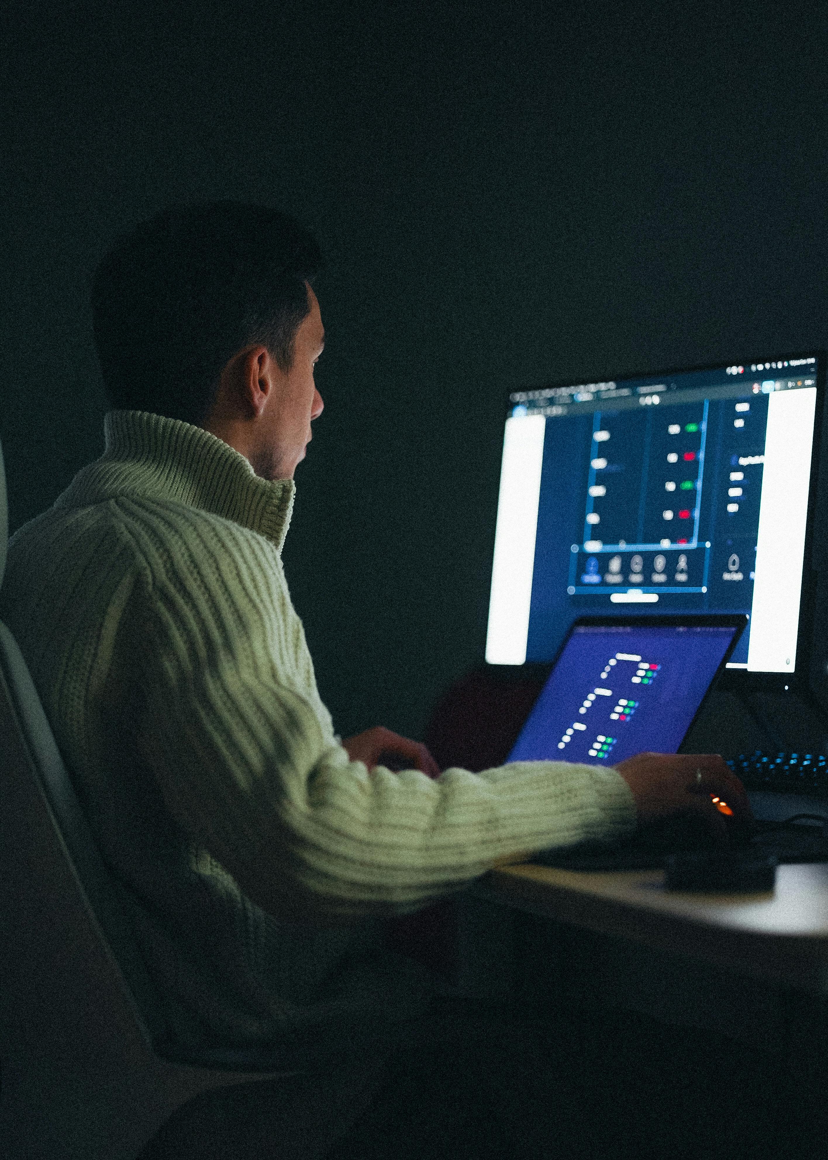 A Person Sitting at a Desk · Free Stock Photo