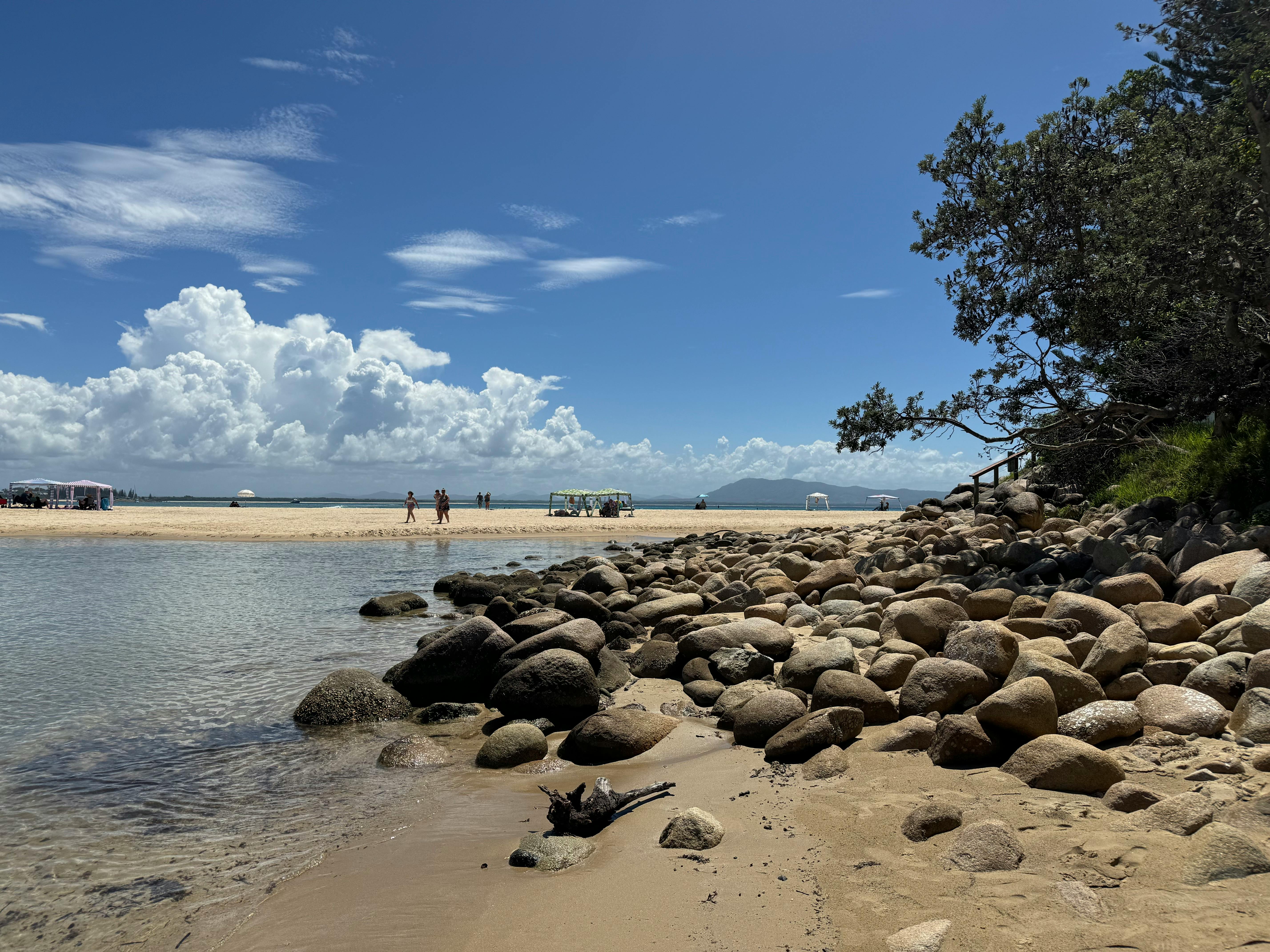Rocks on Sunlit Sea Shore · Free Stock Photo
