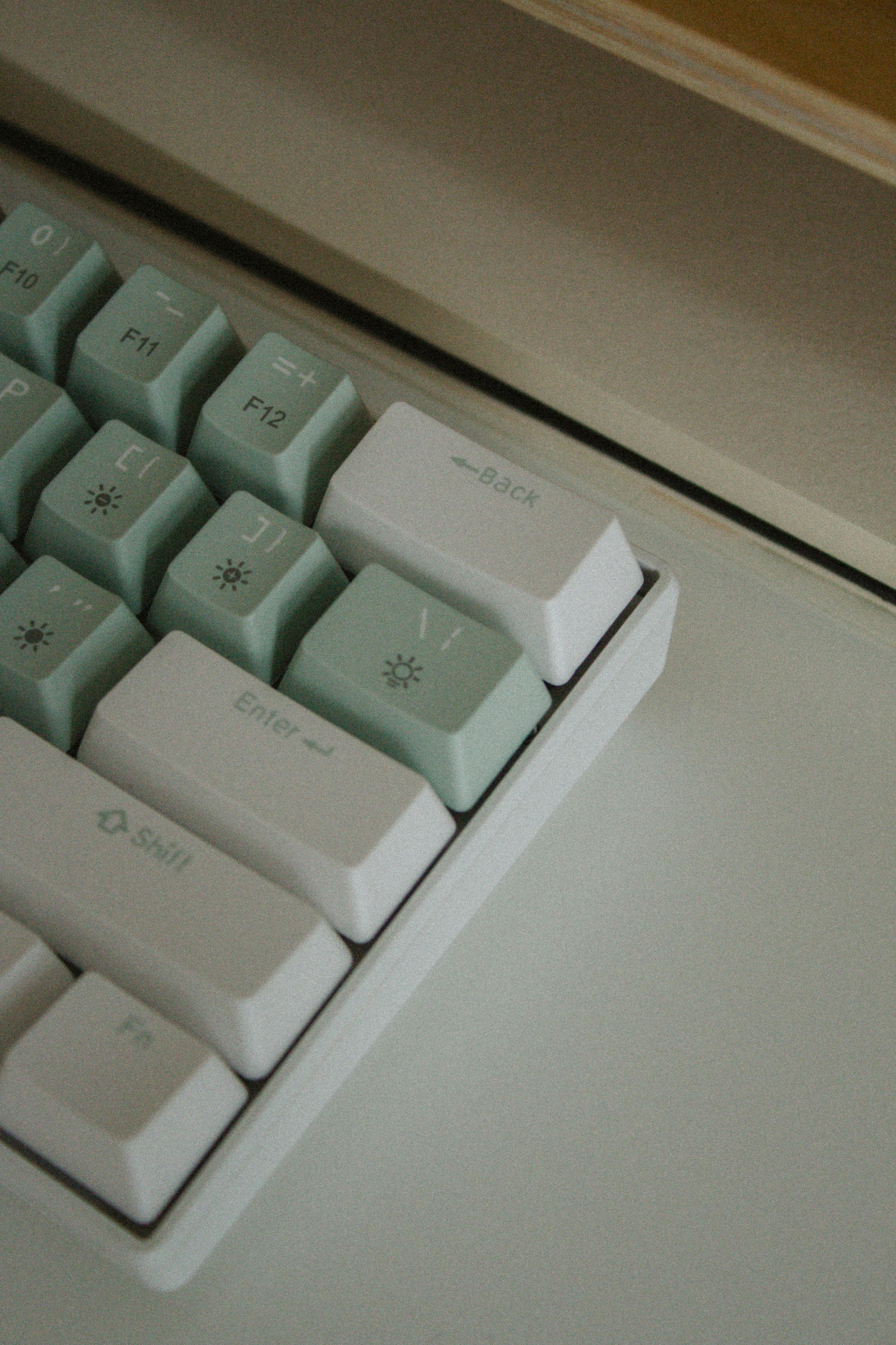 A close up of a keyboard with green keys · Free Stock Photo