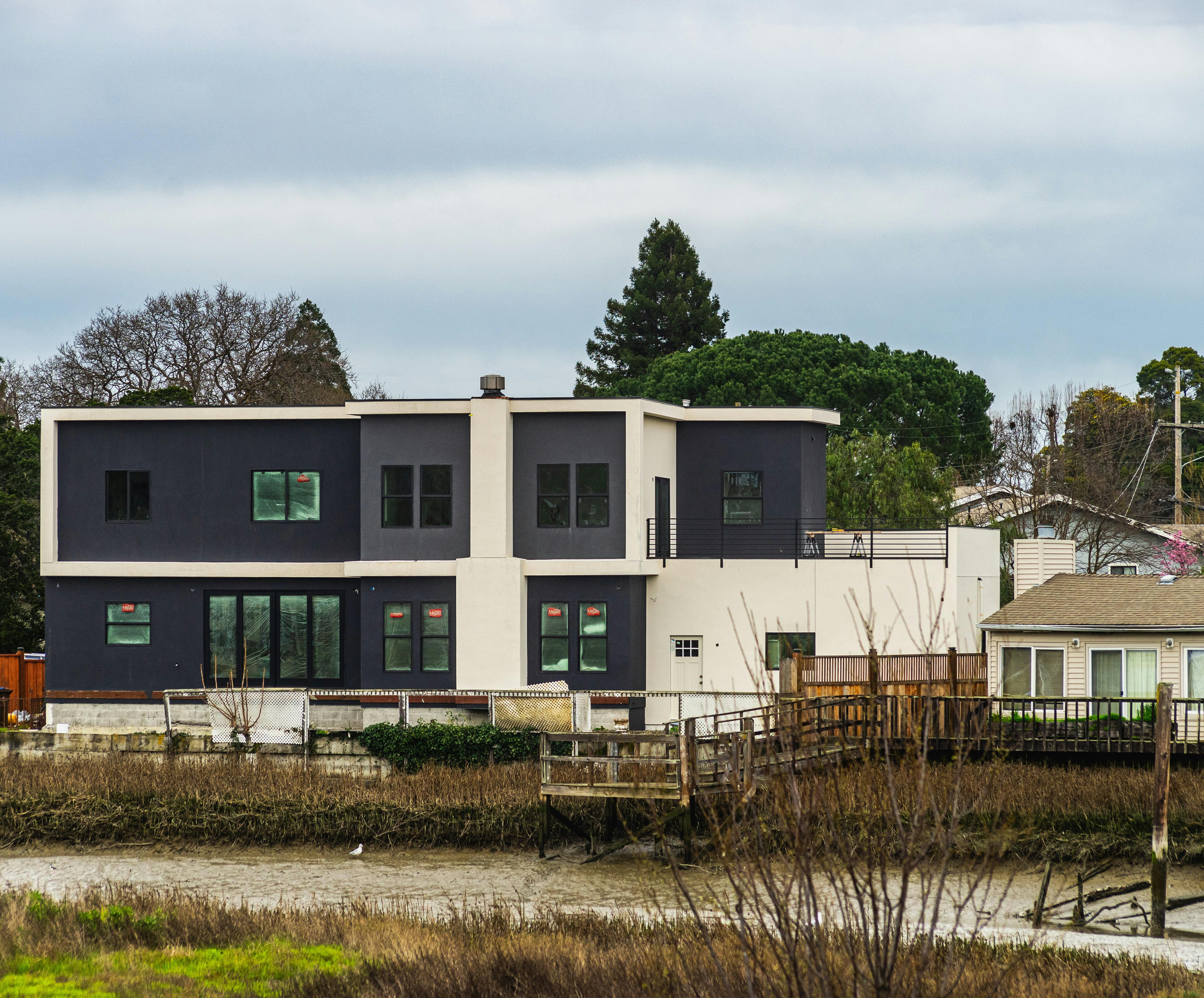 Modern Building by River · Free Stock Photo