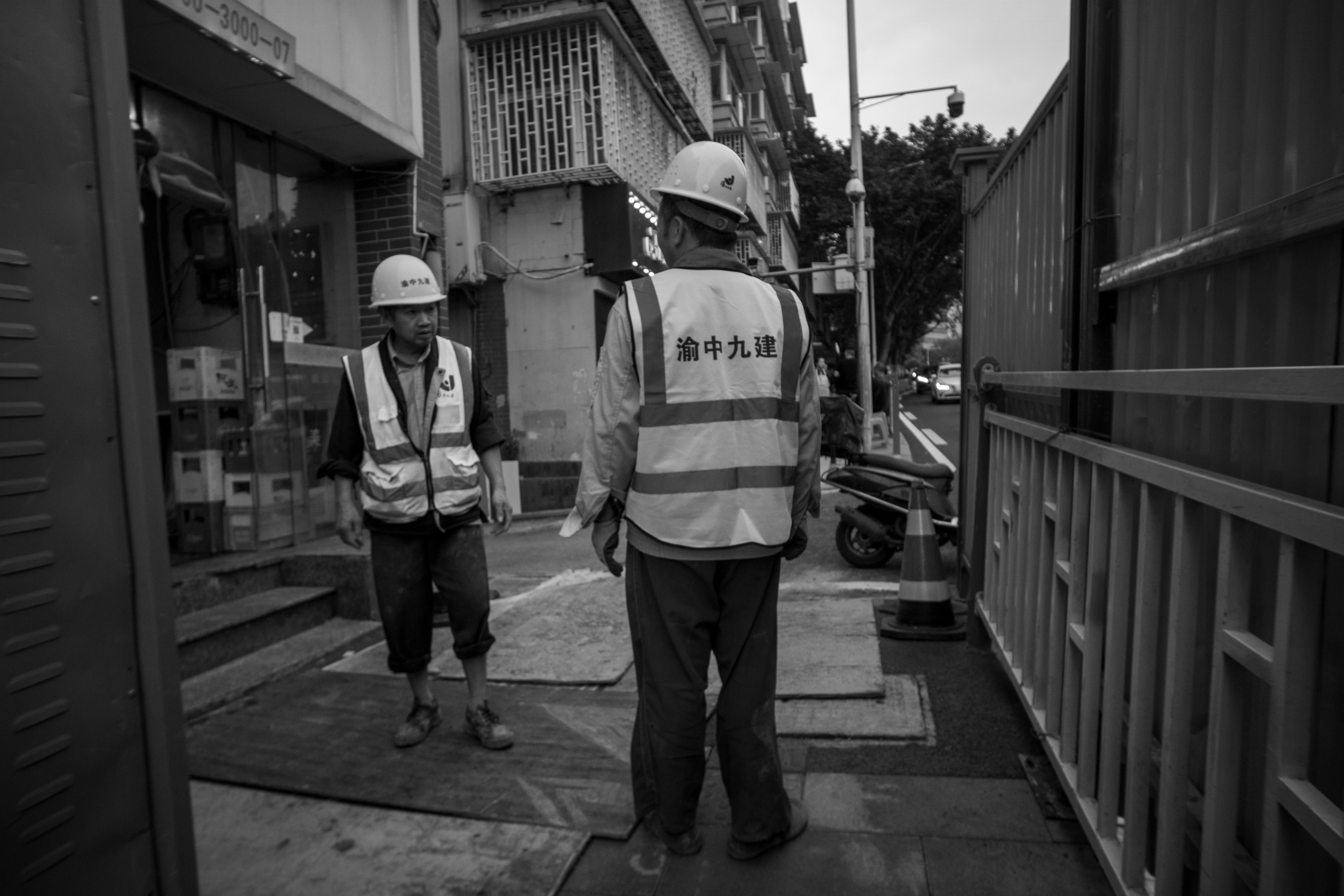 Construction Workers Standing near Building · Free Stock Photo