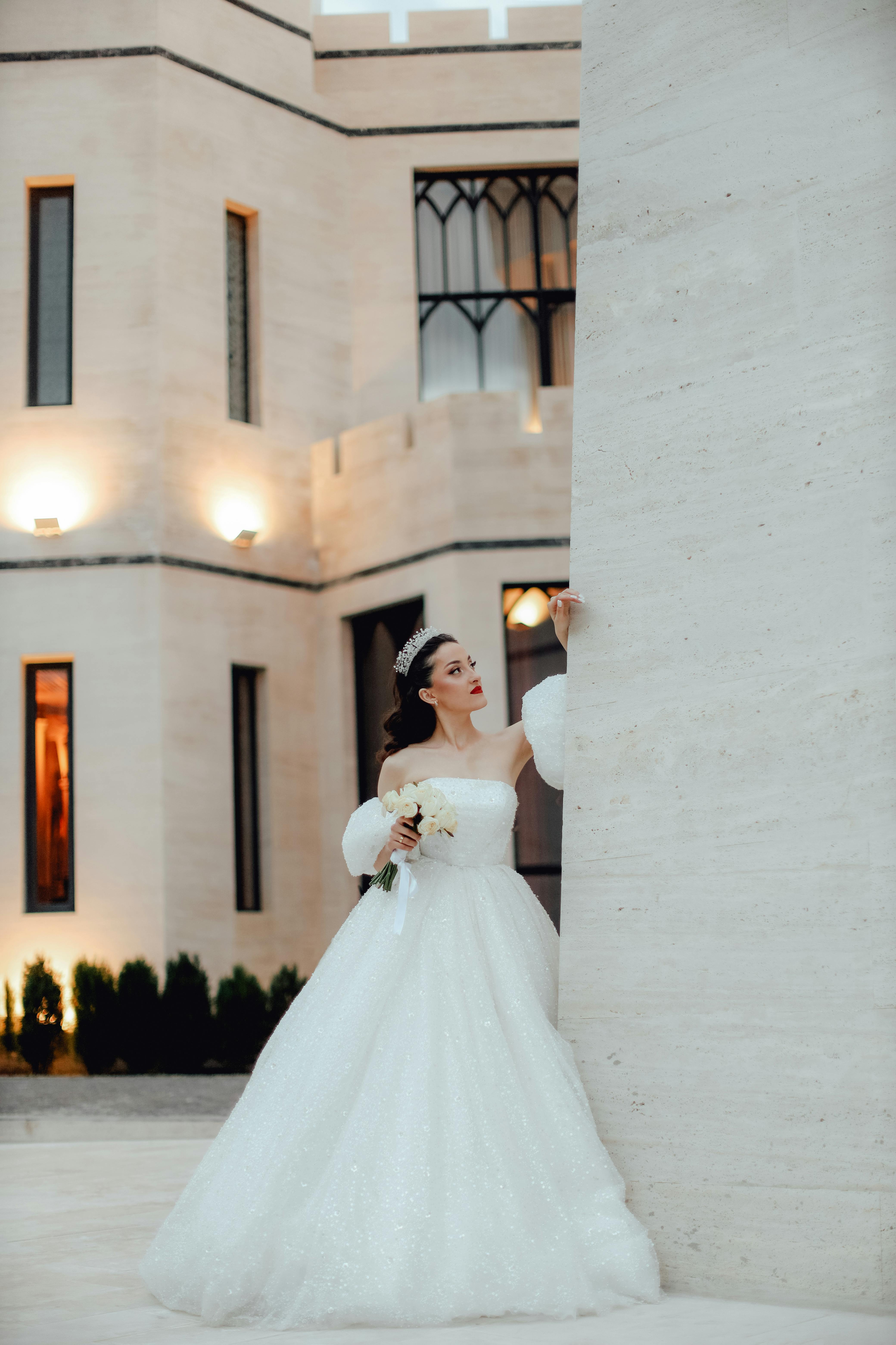 The Bride Standing in the Corner of a Balcony · Free Stock Photo